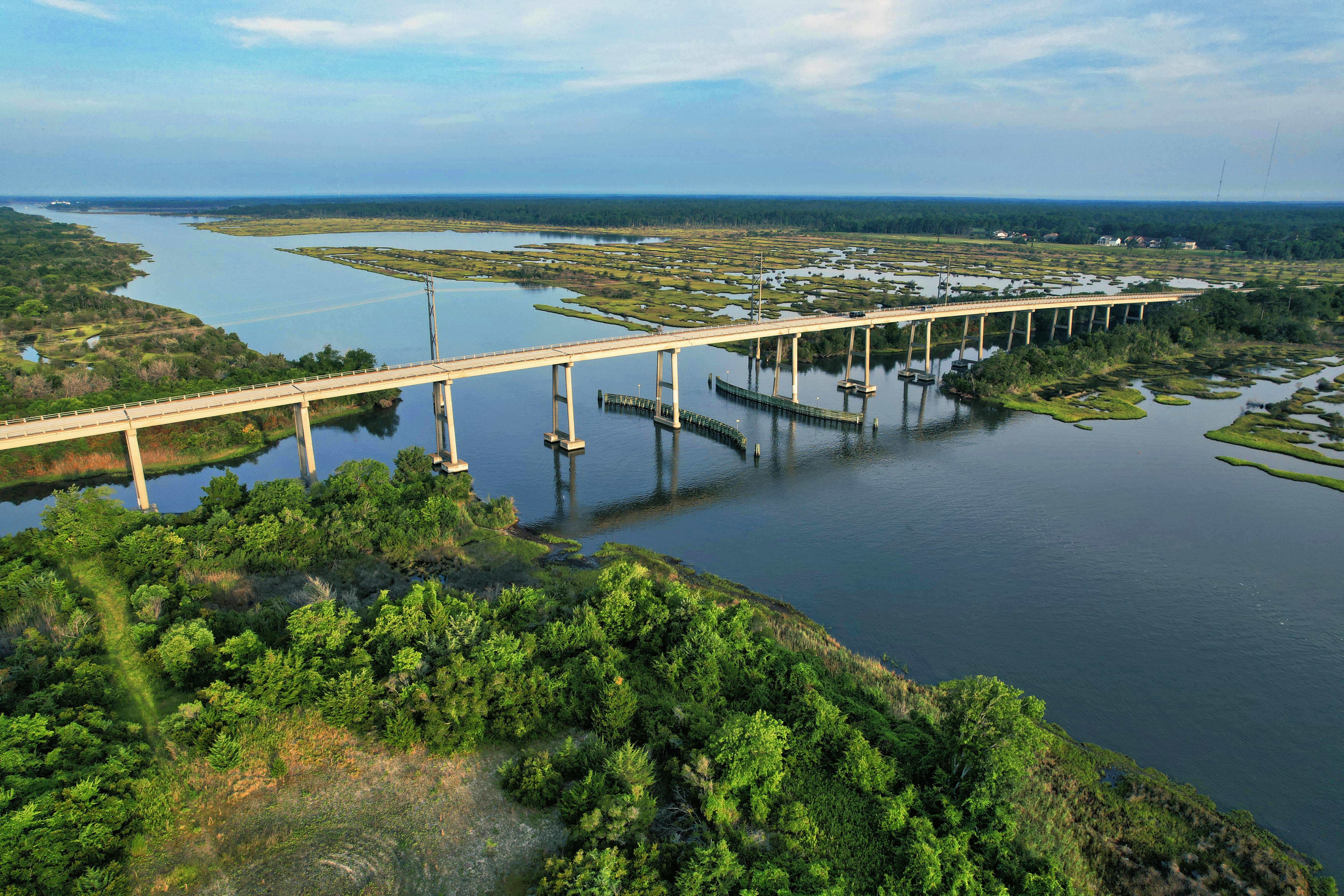 An aerial view of a bridge over a body of water photo – Free North ...