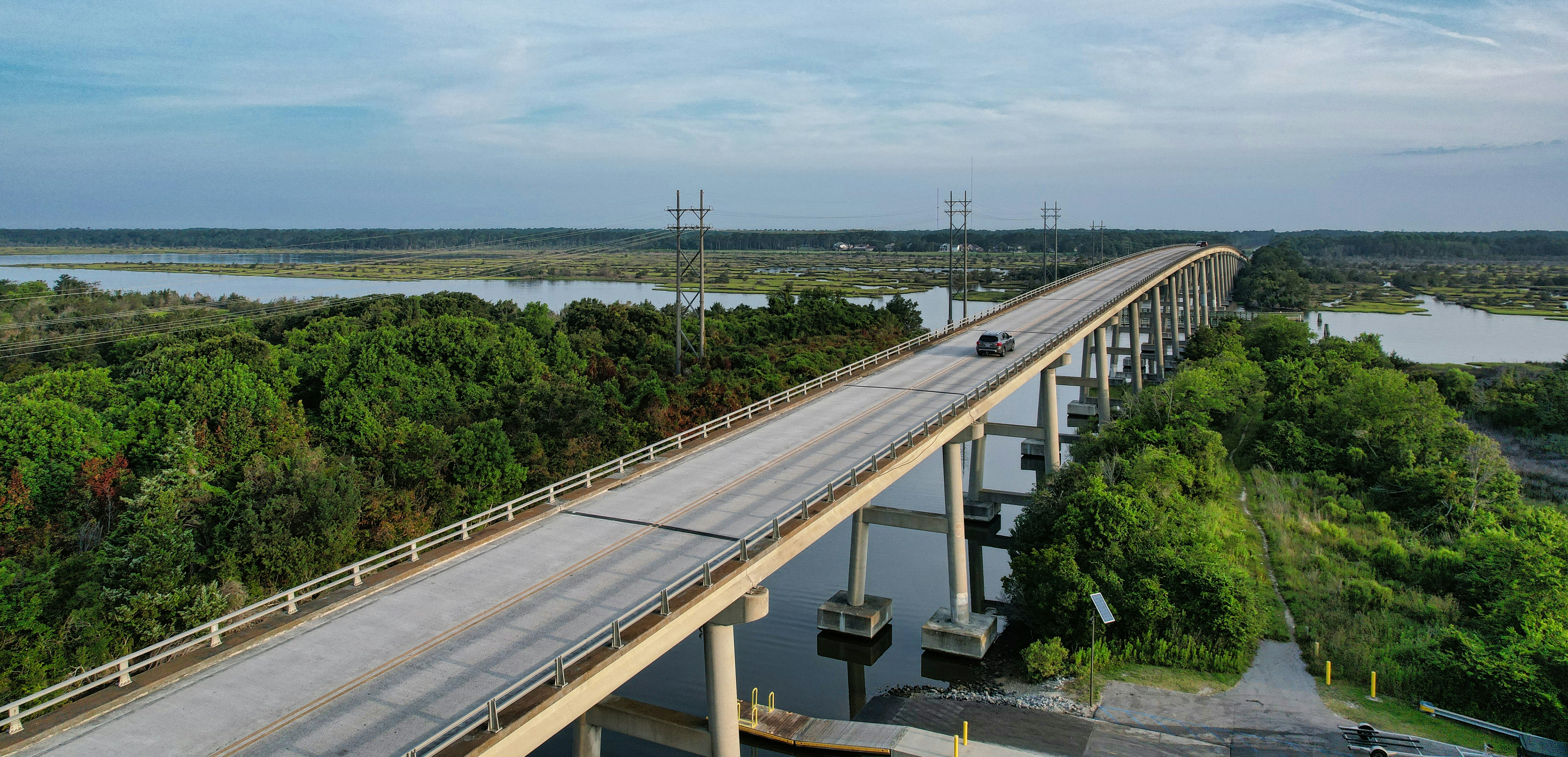 A long bridge over a large body of water photo – Free North topsail ...