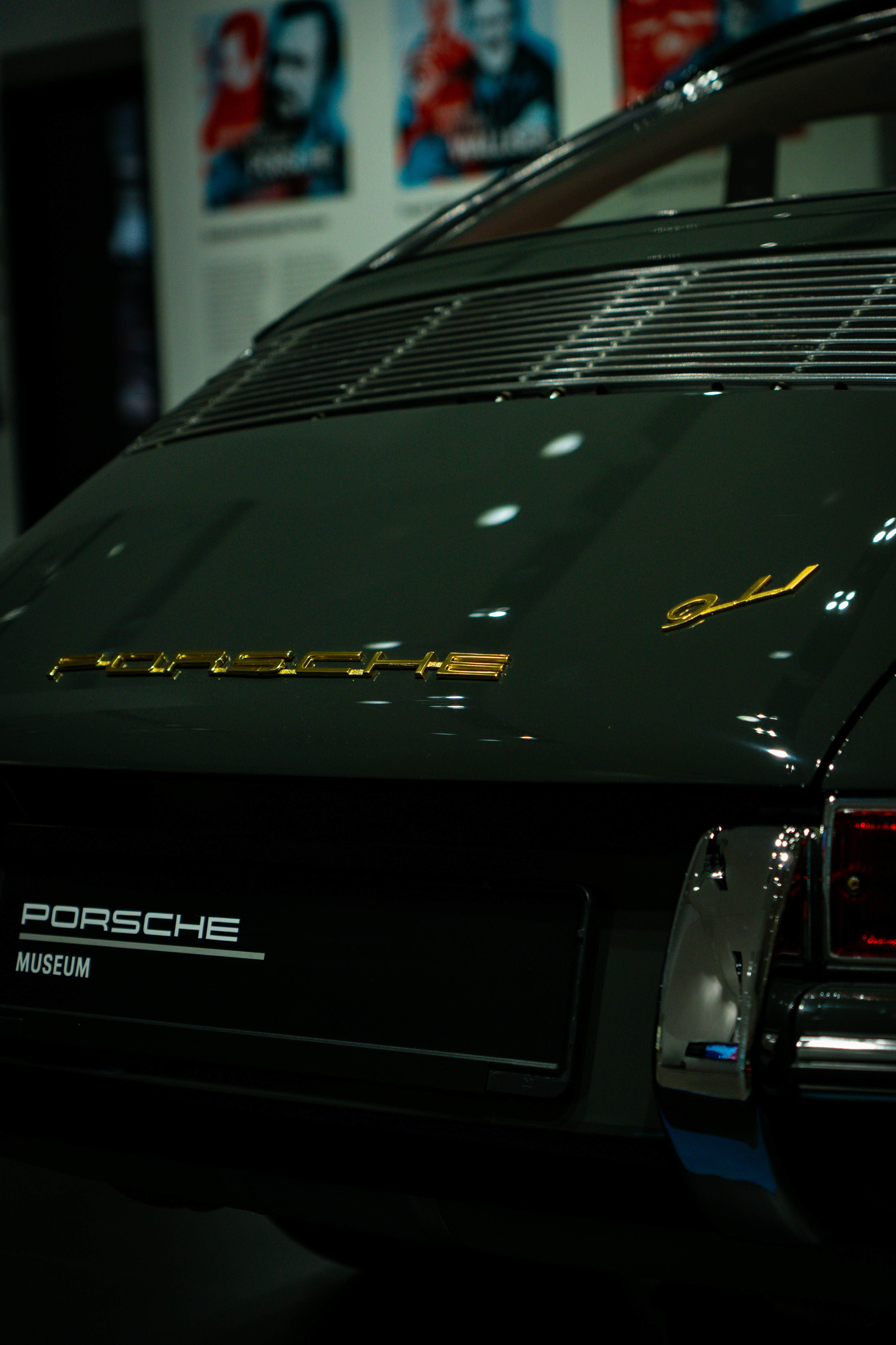 The back end of a black porsche car in a showroom photo – Free Vintage ...