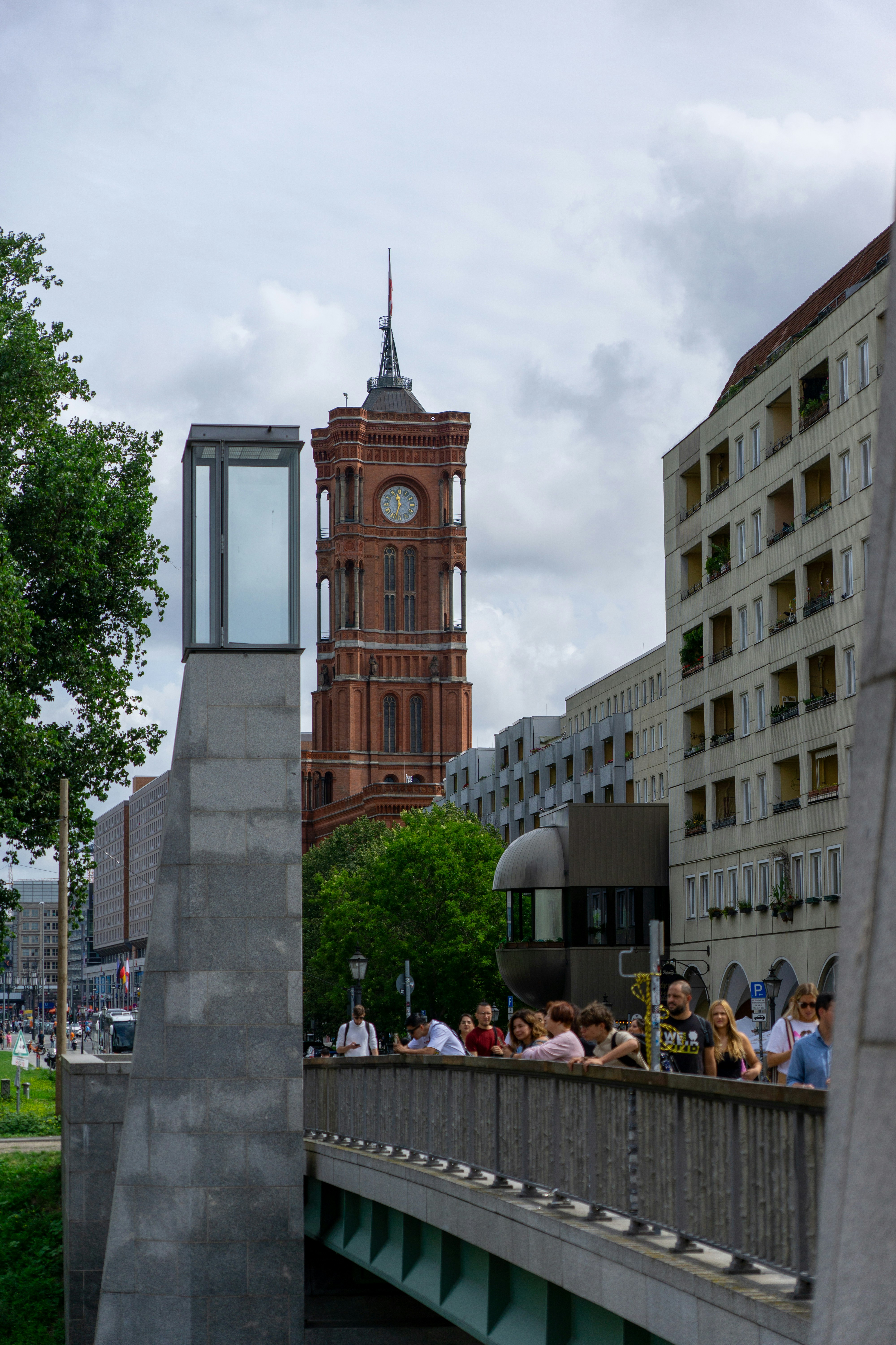 Clock Tower over the Canal: City Walk Under a Sky of Clouds