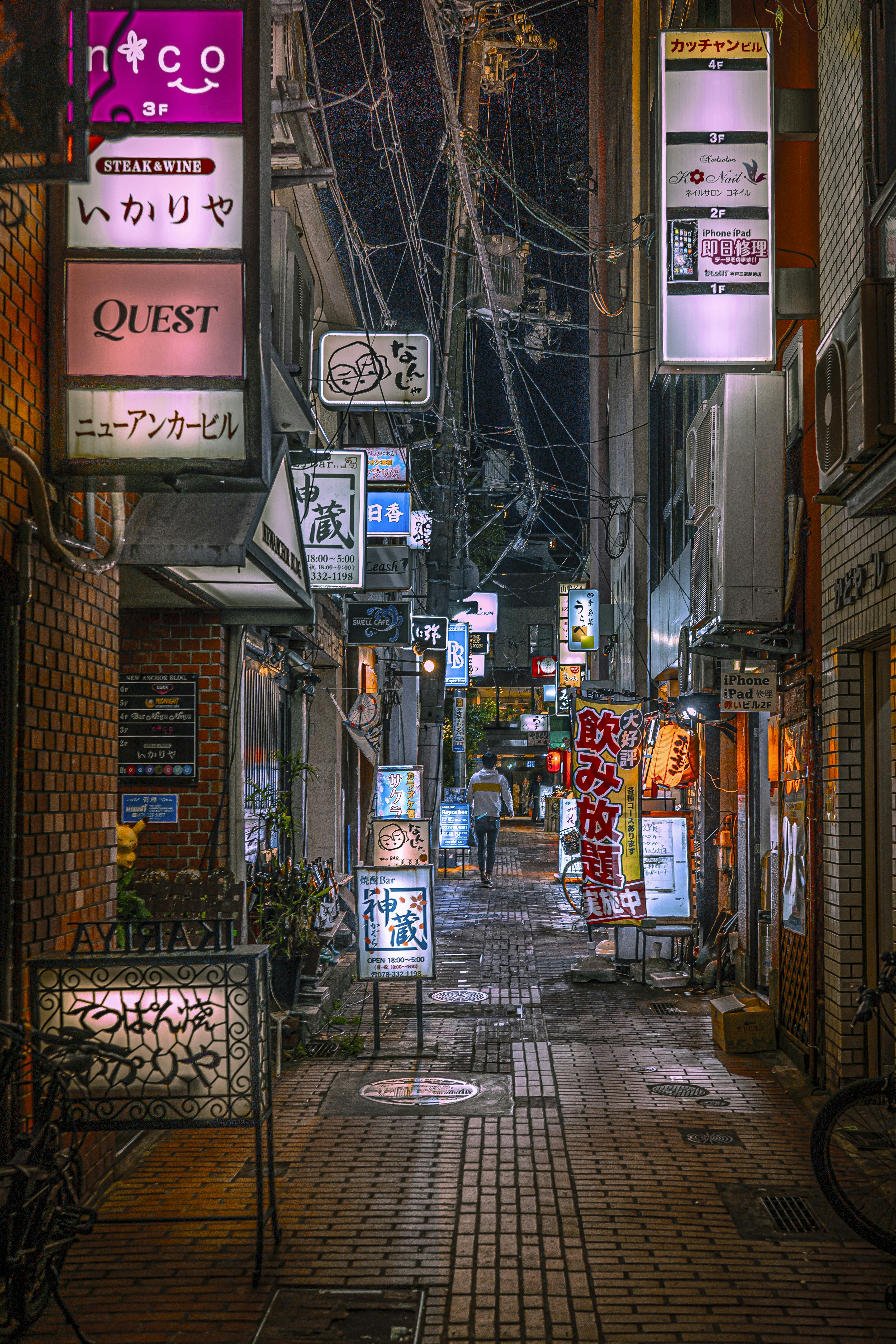 A narrow alley way with signs on the buildings photo – Free Osaka Image ...