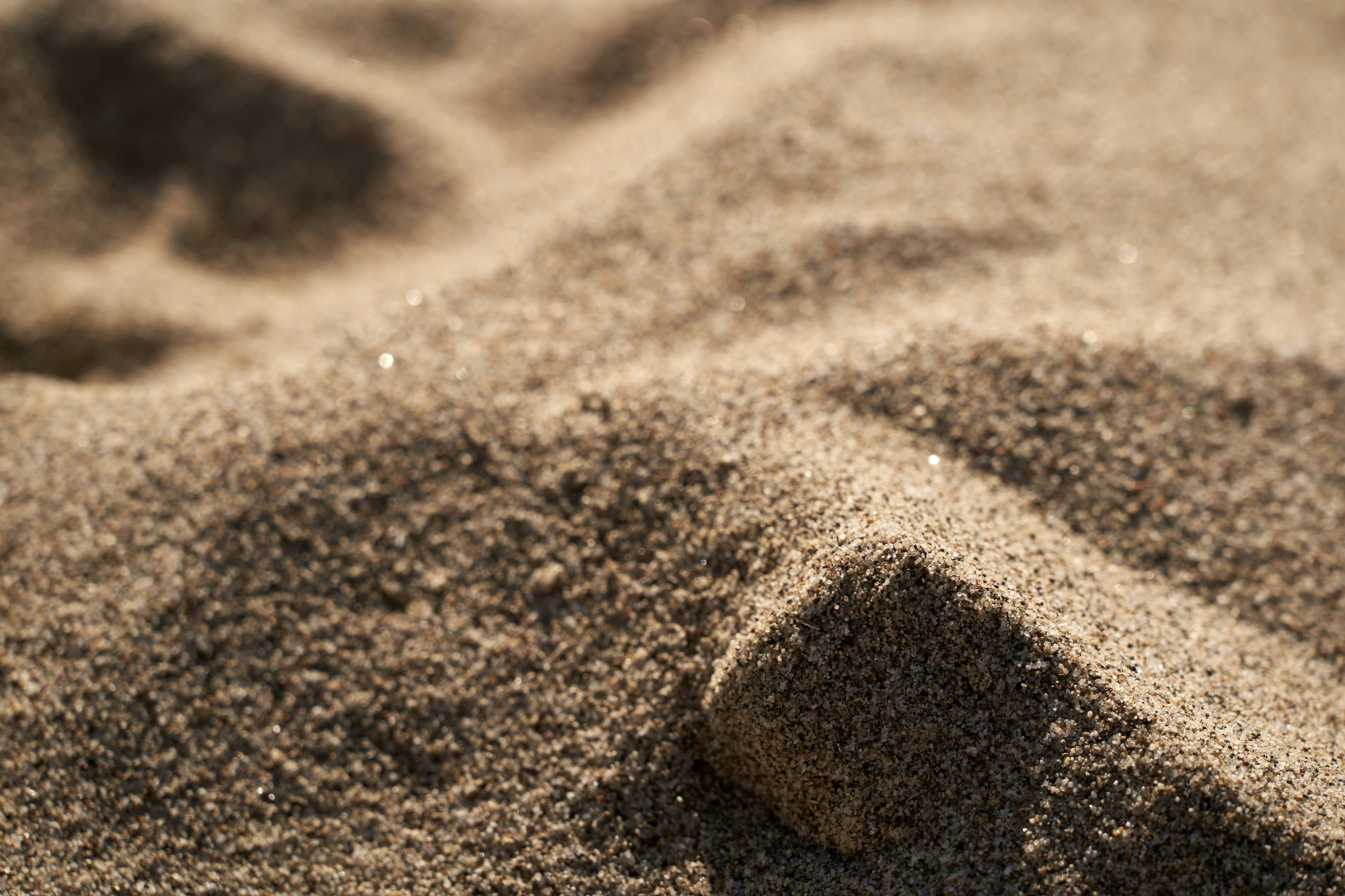 A sand dune with a heart shaped object in the sand photo – Free Pattern ...