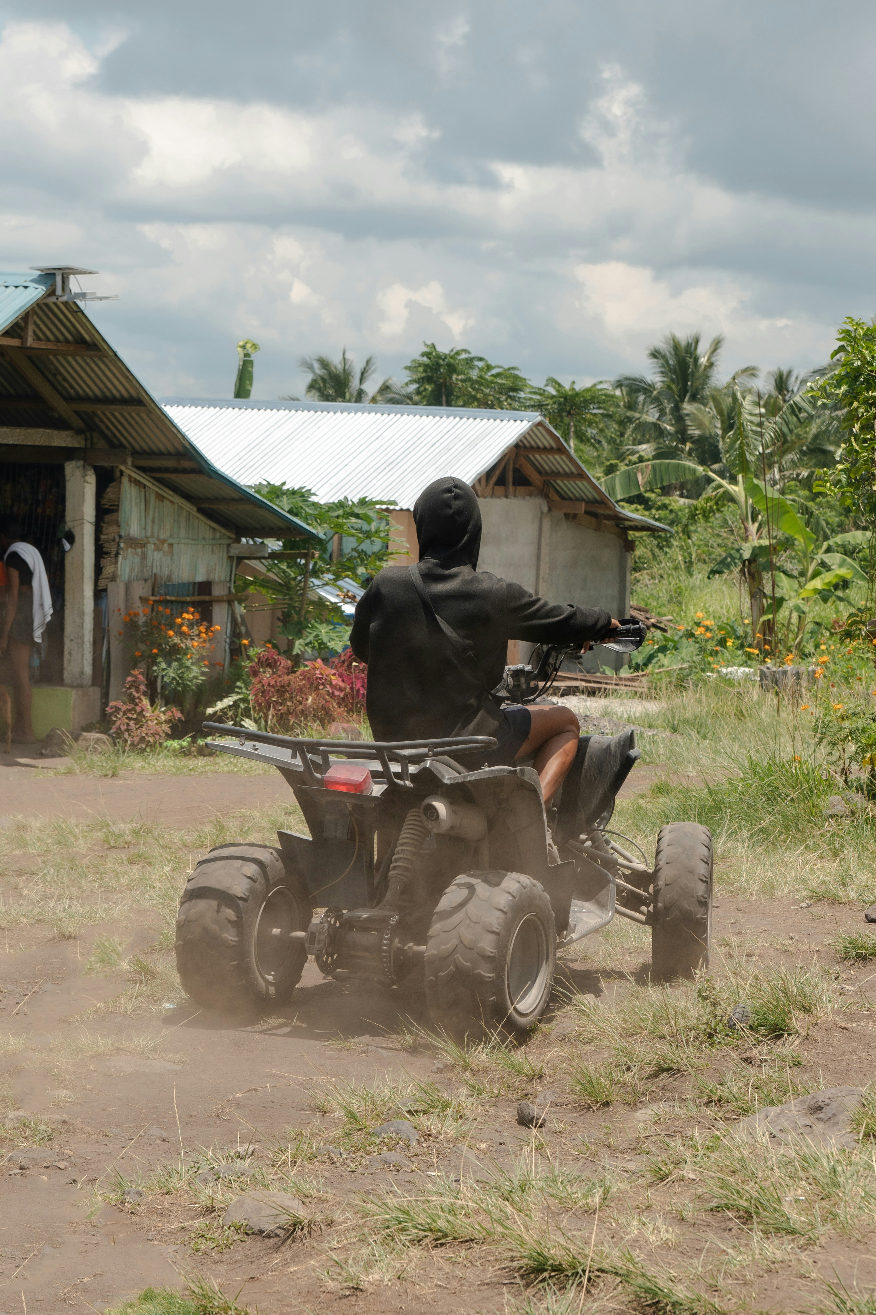 A man riding on the back of an atv photo – Free Mayon volcano Image on ...