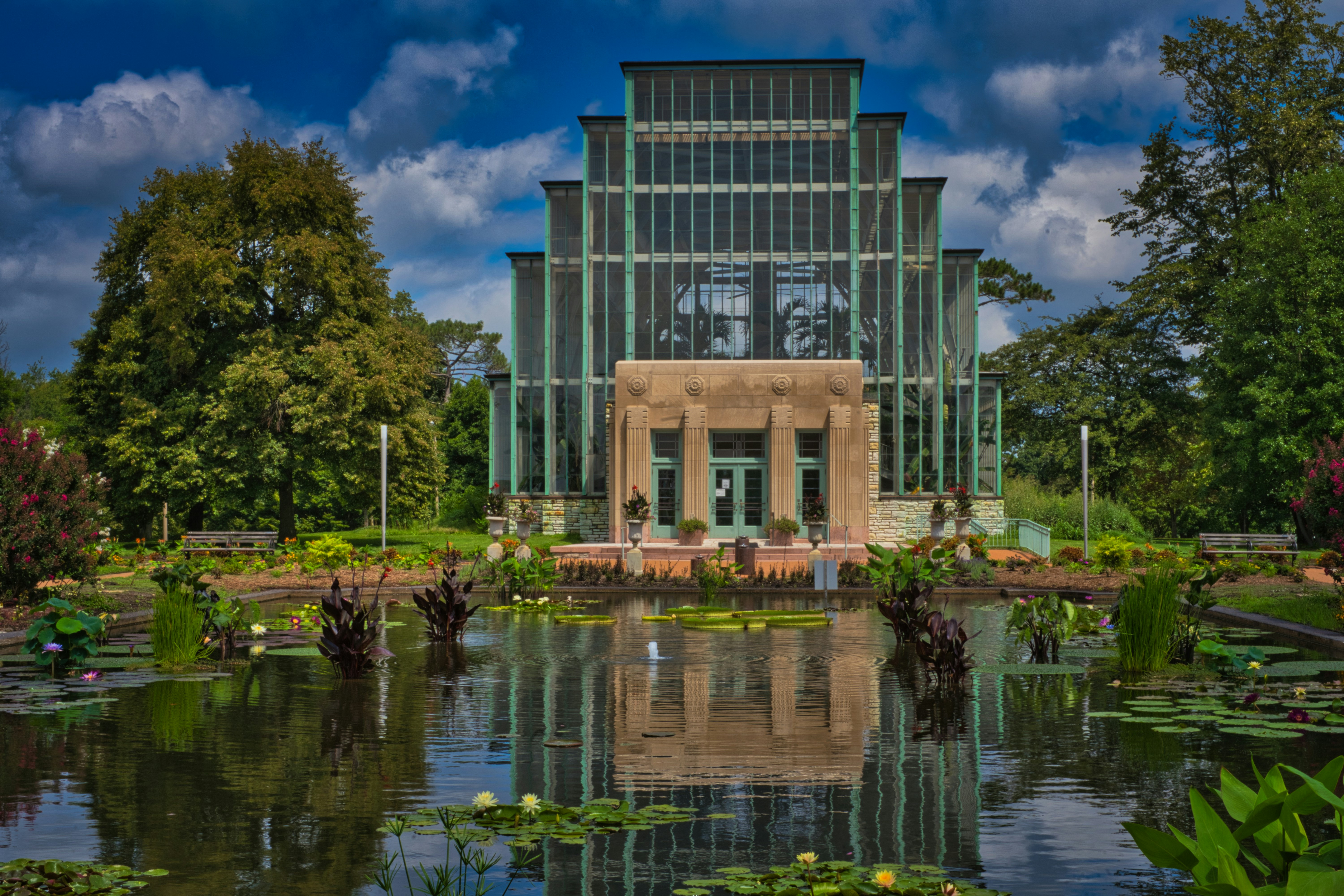 Glass Conservatory Over a Tranquil Lily Pond: Reflections in Glass and Water