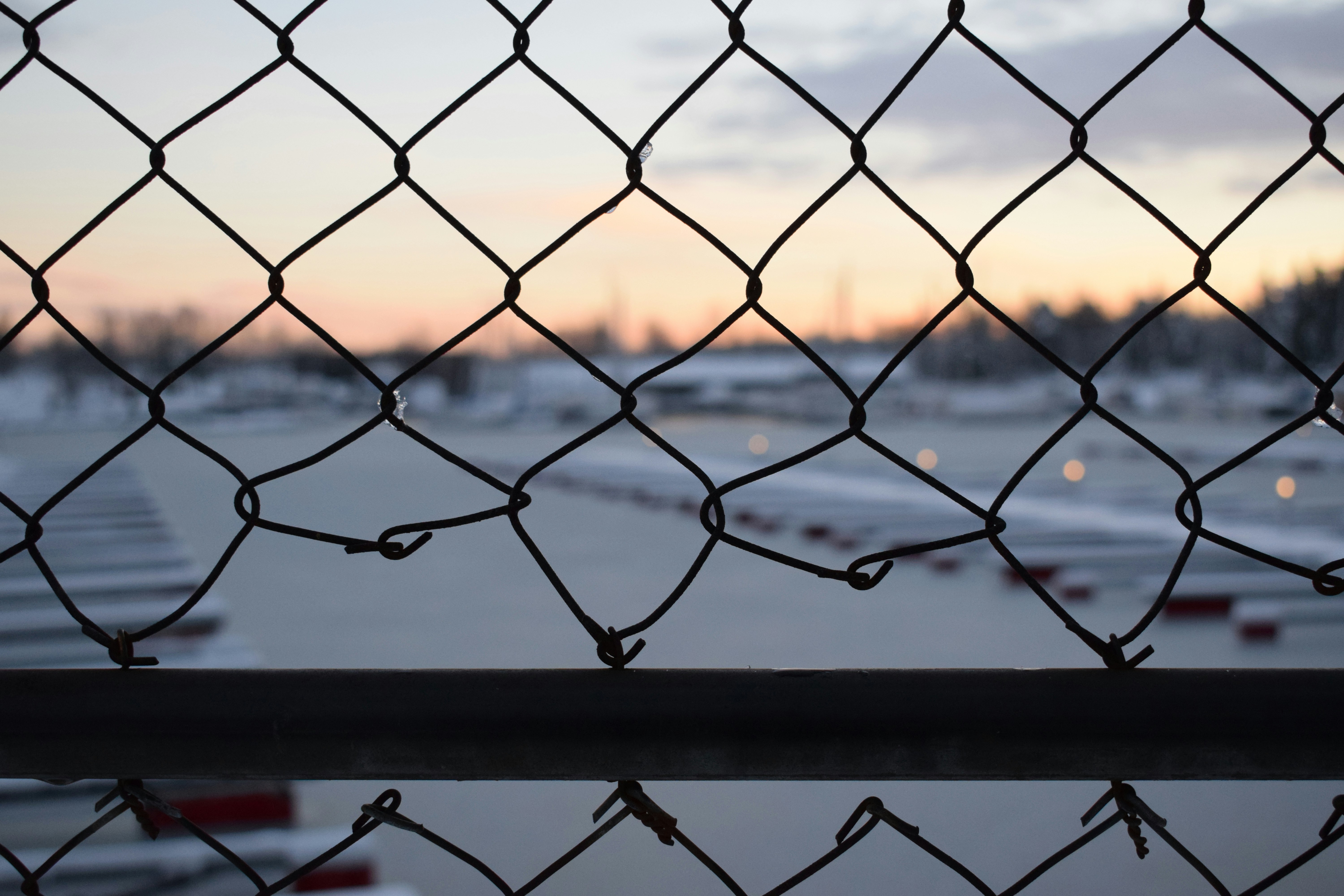 Fence Diamonds at Sunset Over a Snowbound Harbor