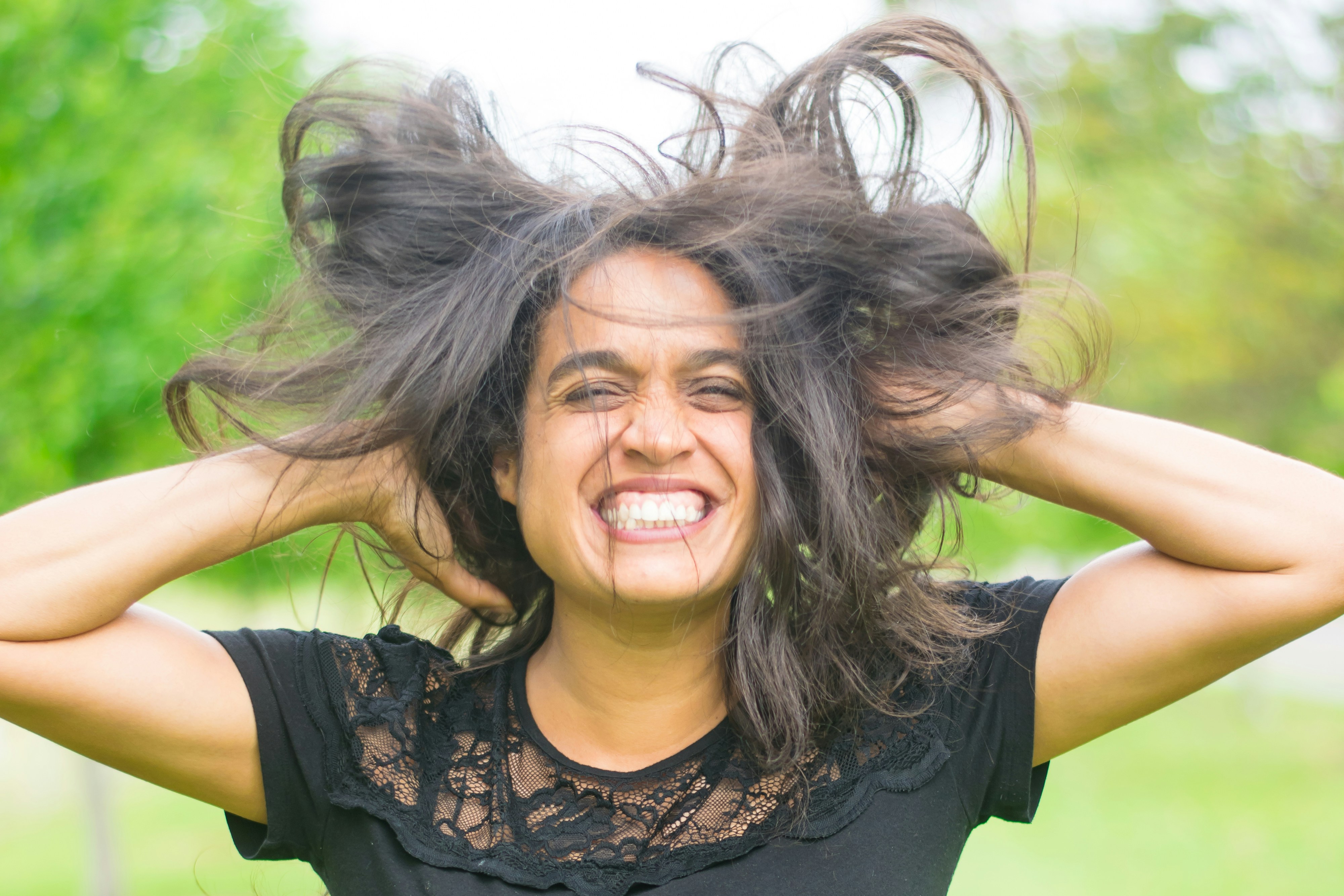 A woman with her hair in the air photo – Free Face Image on Unsplash