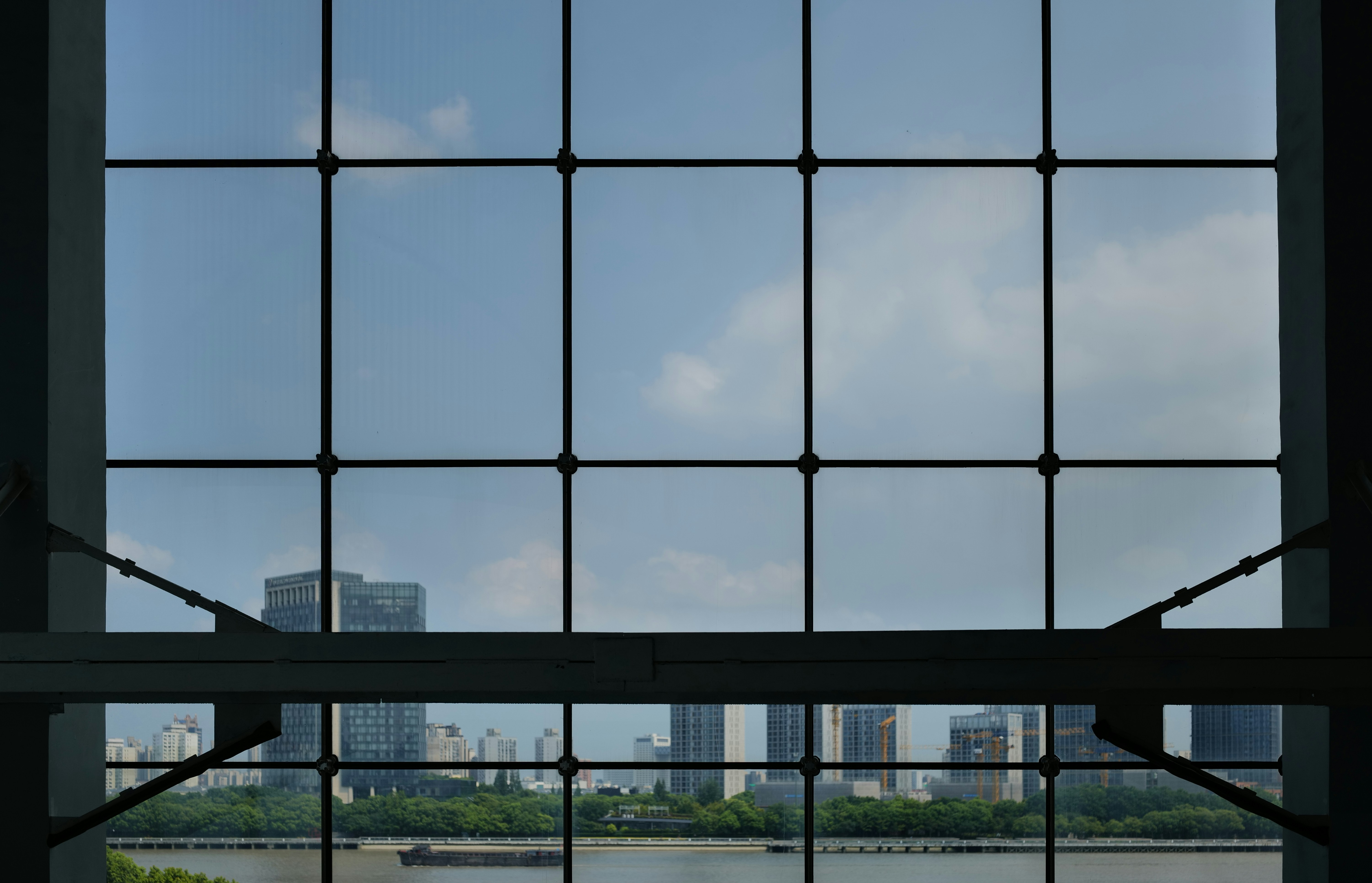 A view of a city through a window photo – Free Power station of art ...