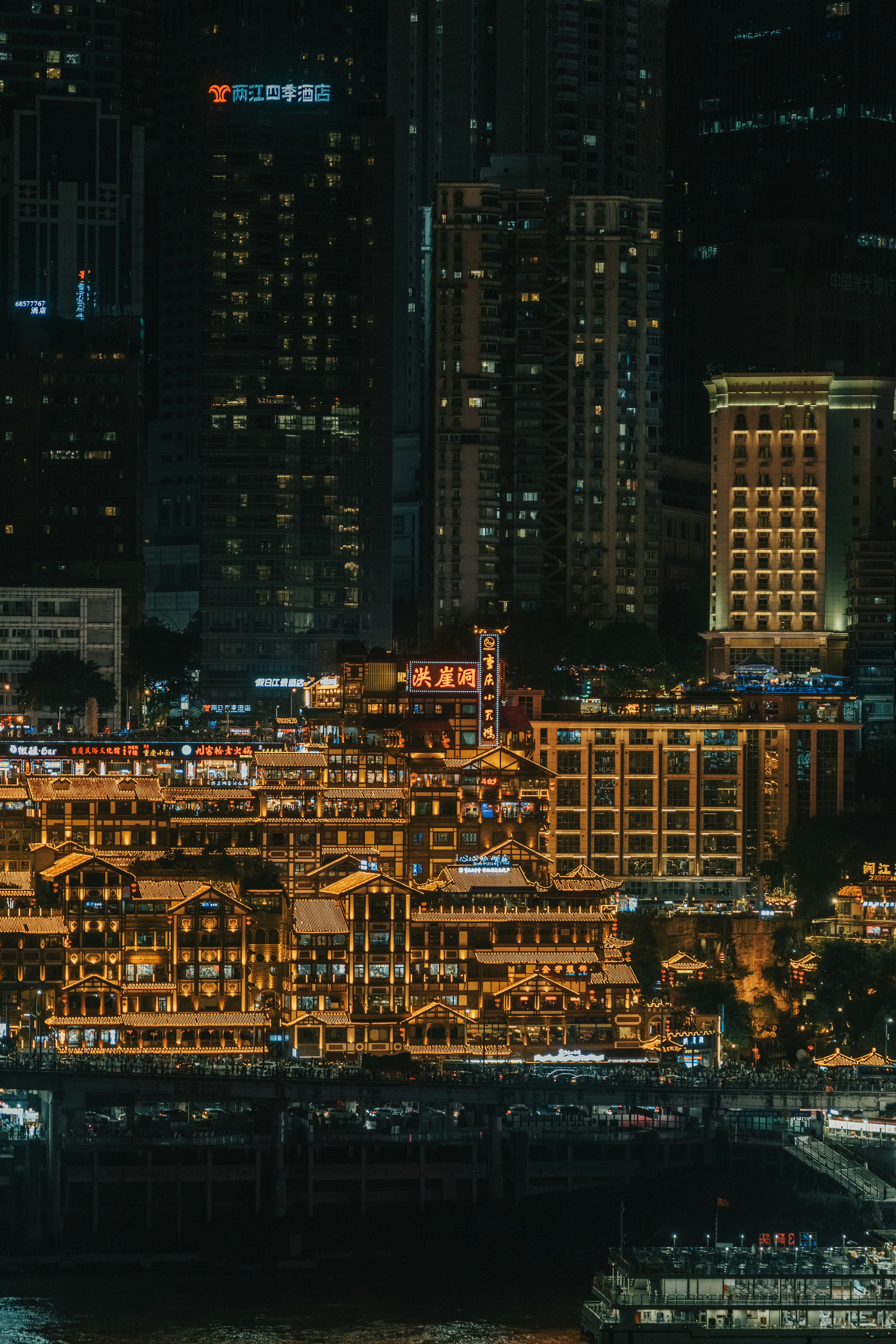 Amber Cascades Along a Night Riverfront: A Layered Skyline