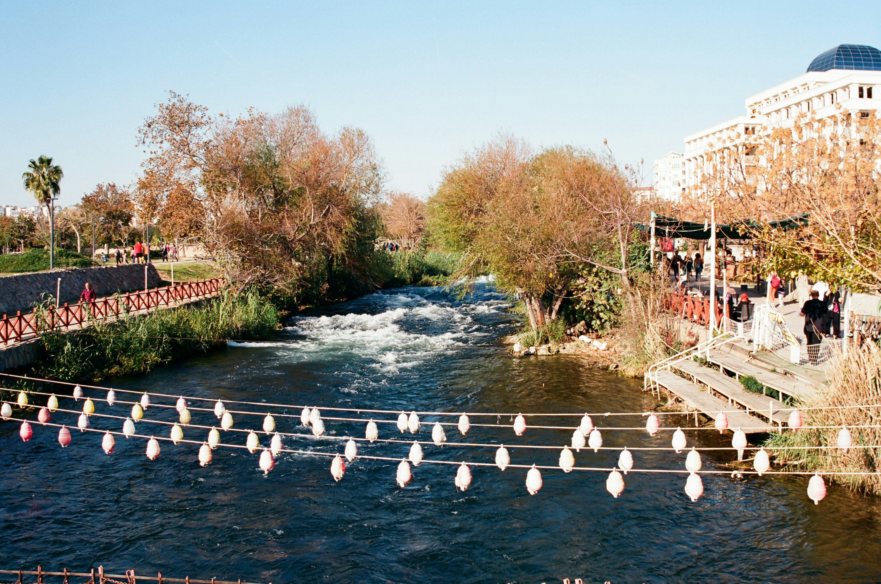 A river running through a city next to tall buildings photo – Free ...
