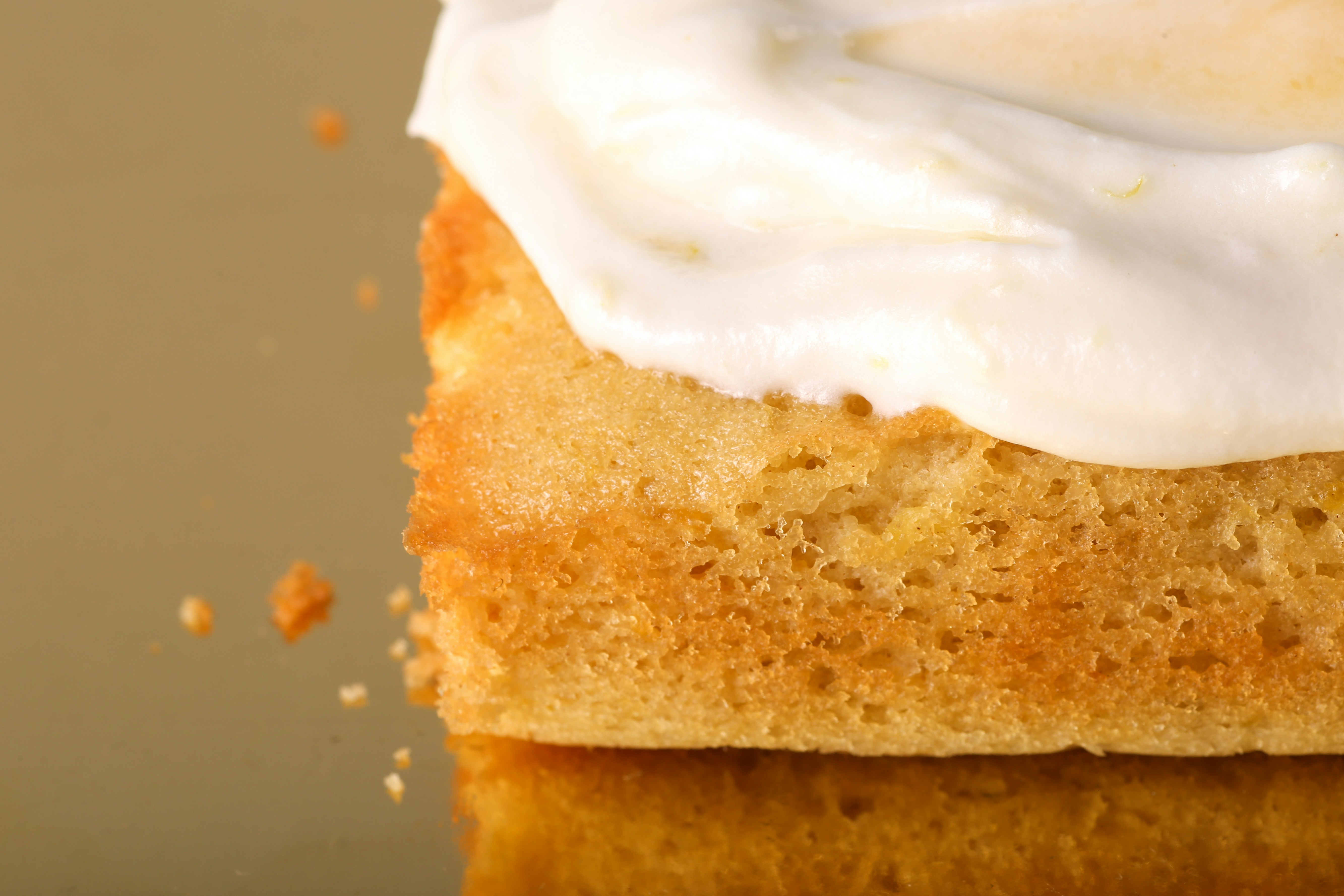 A close up of a piece of cake with icing photo – Free Food Image on ...