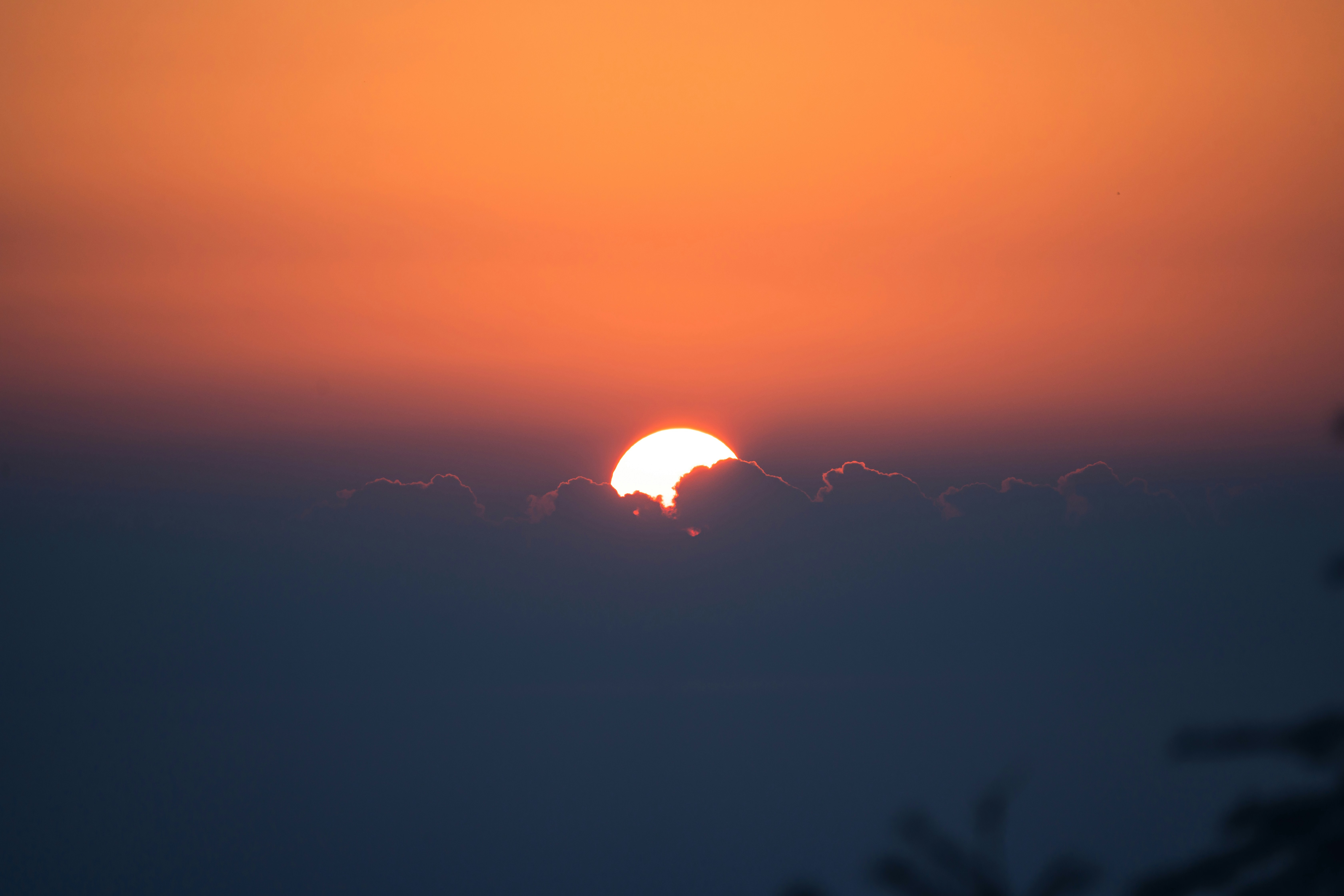 The sun is setting over the clouds in the sky photo – Free Sunrise ...