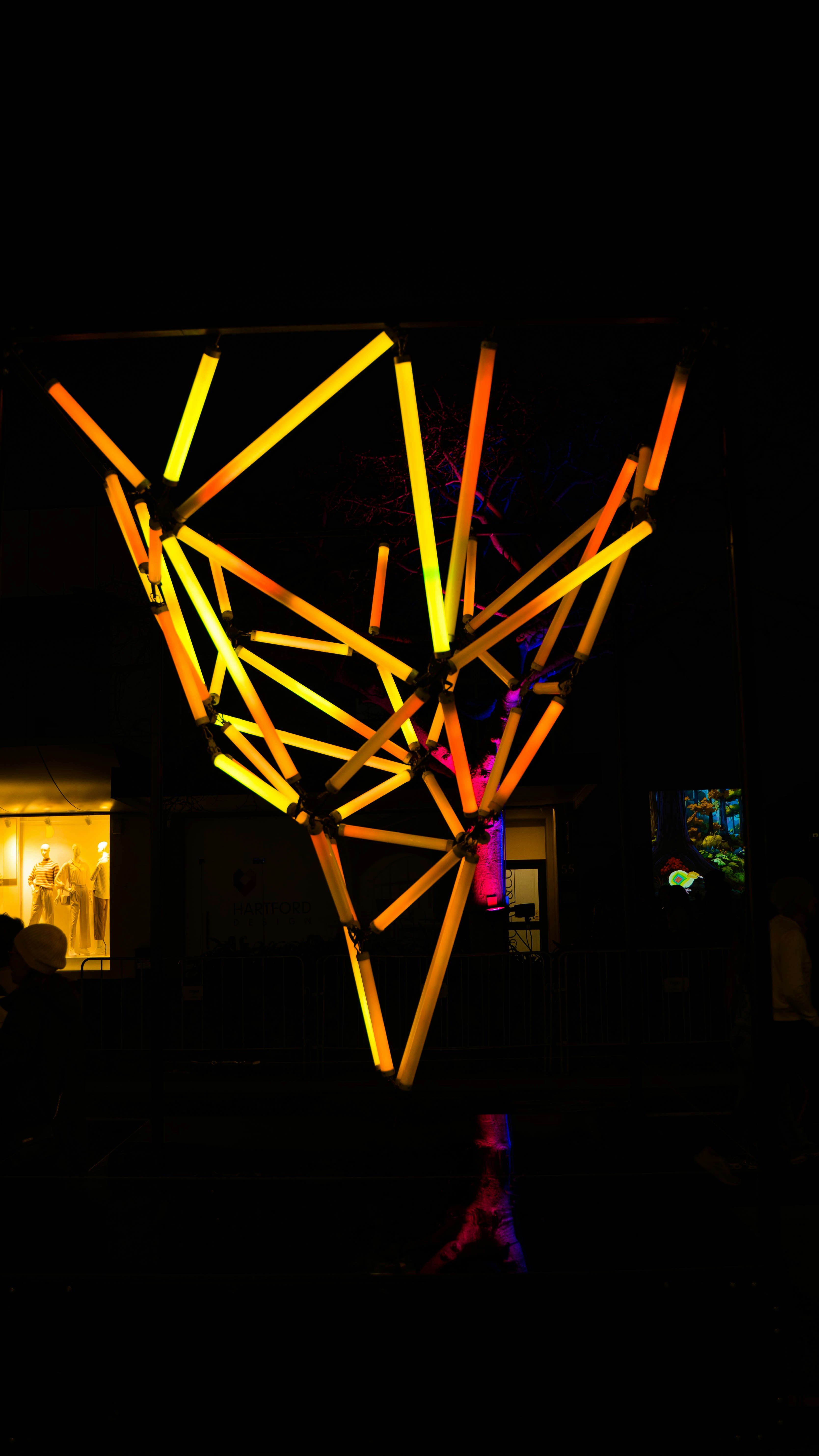 A sculpture made out of sticks in the dark photo – Free Man Image on ...