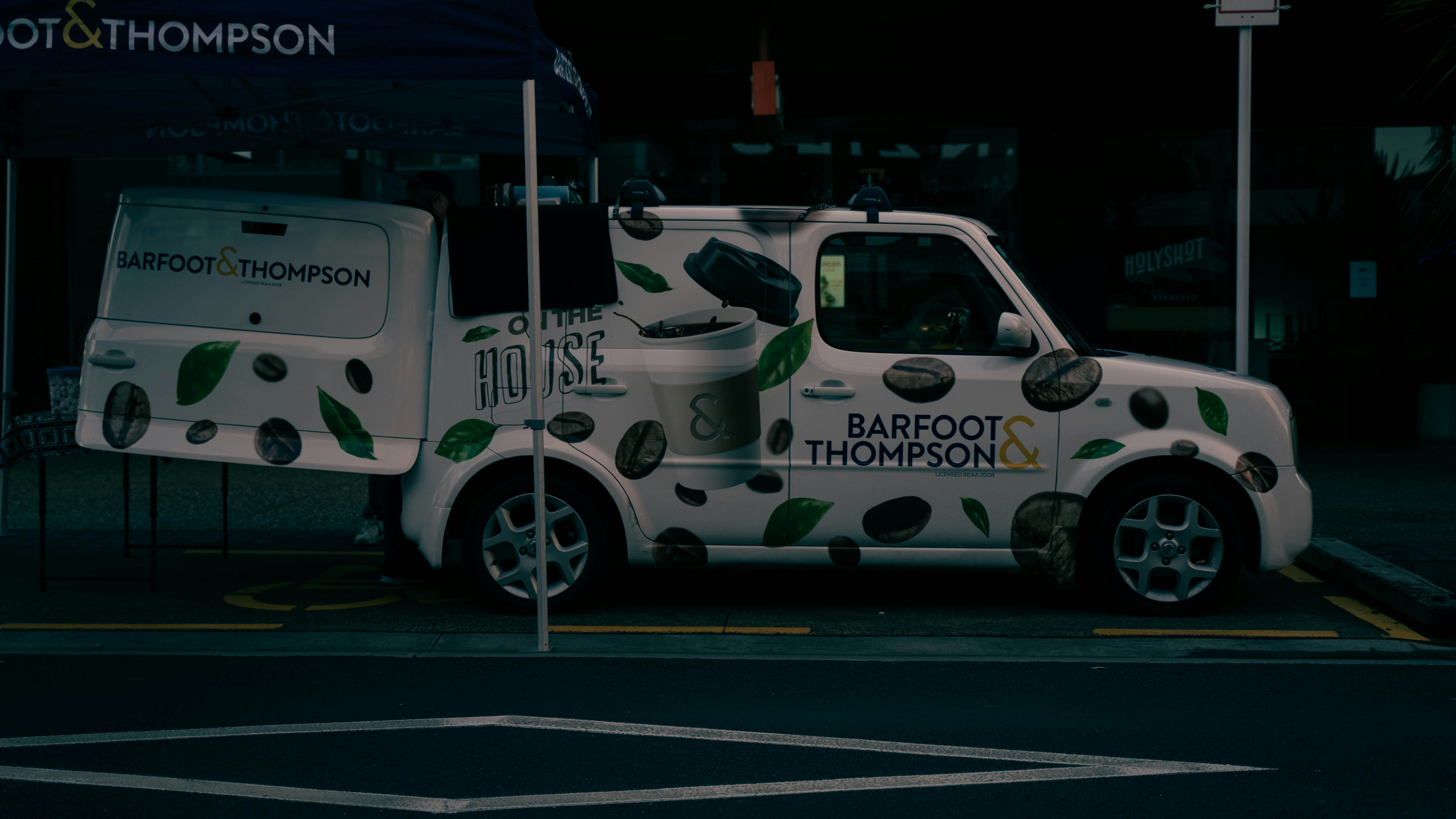 Leaf-Patterned Barfoot & Thompson Van Anchors a Quiet City Street