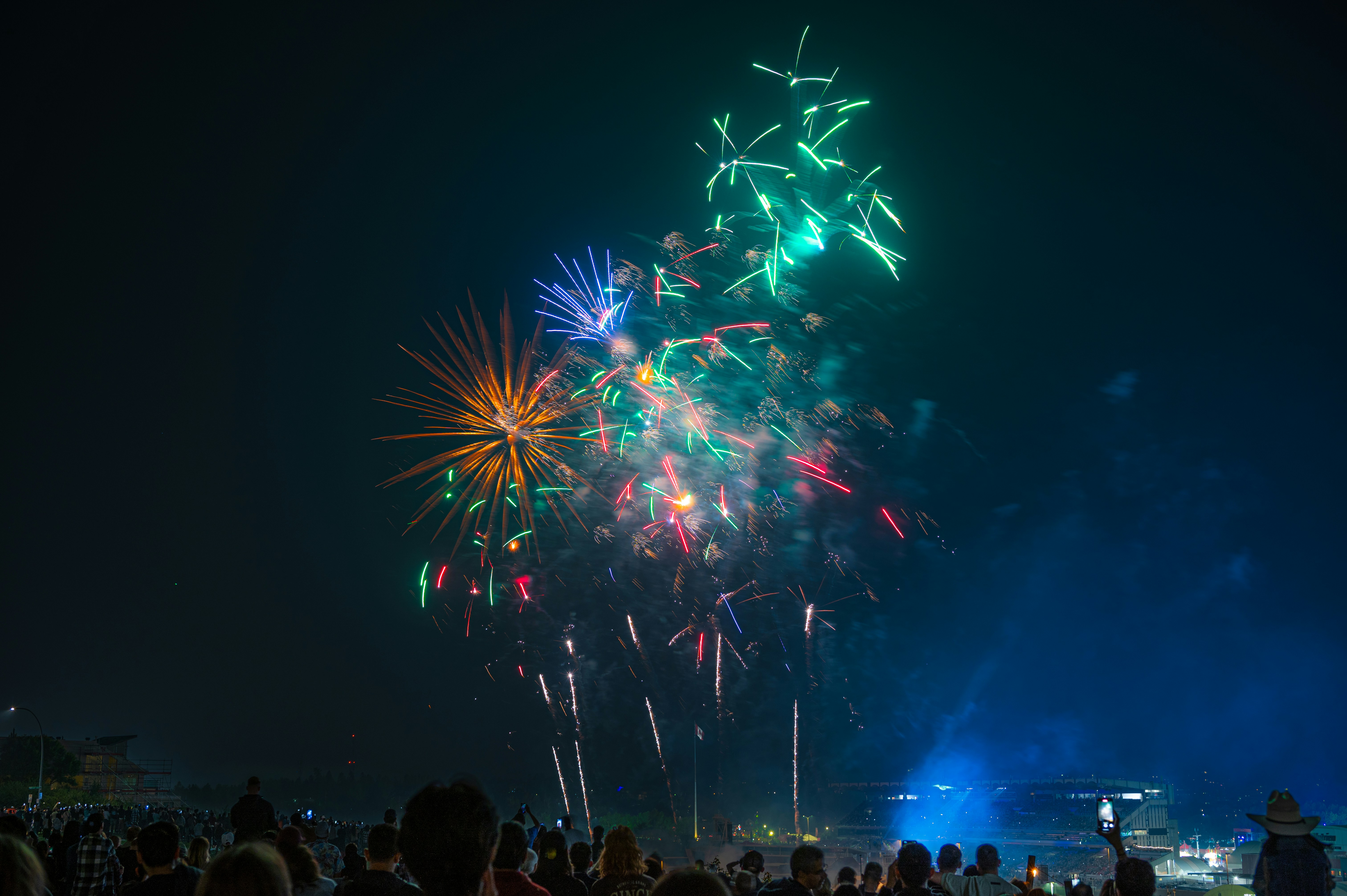 A crowd of people watching a fireworks display photo – Free Calgary ...