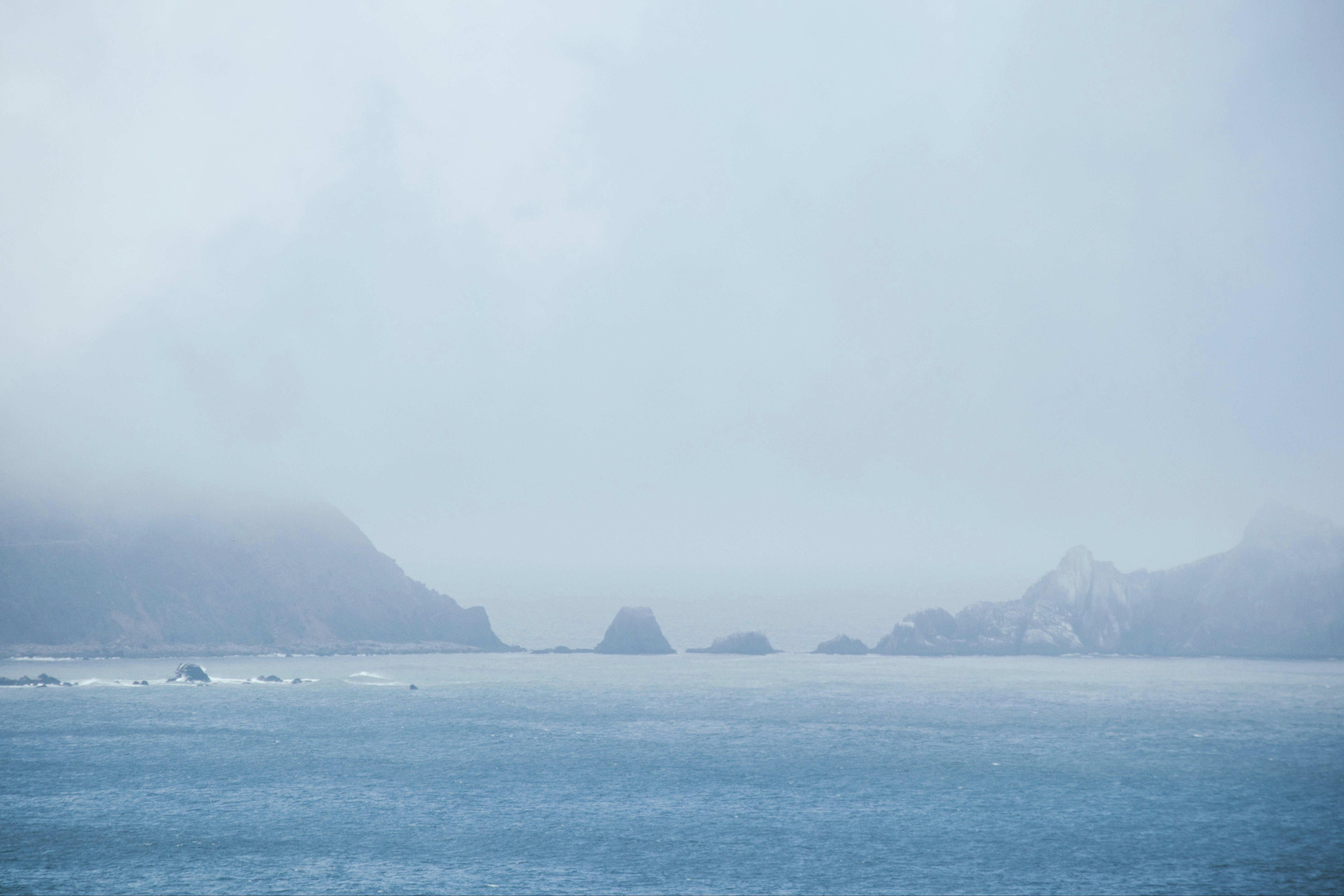 A large body of water surrounded by mountains photo – Free Mori point Image on Unsplash