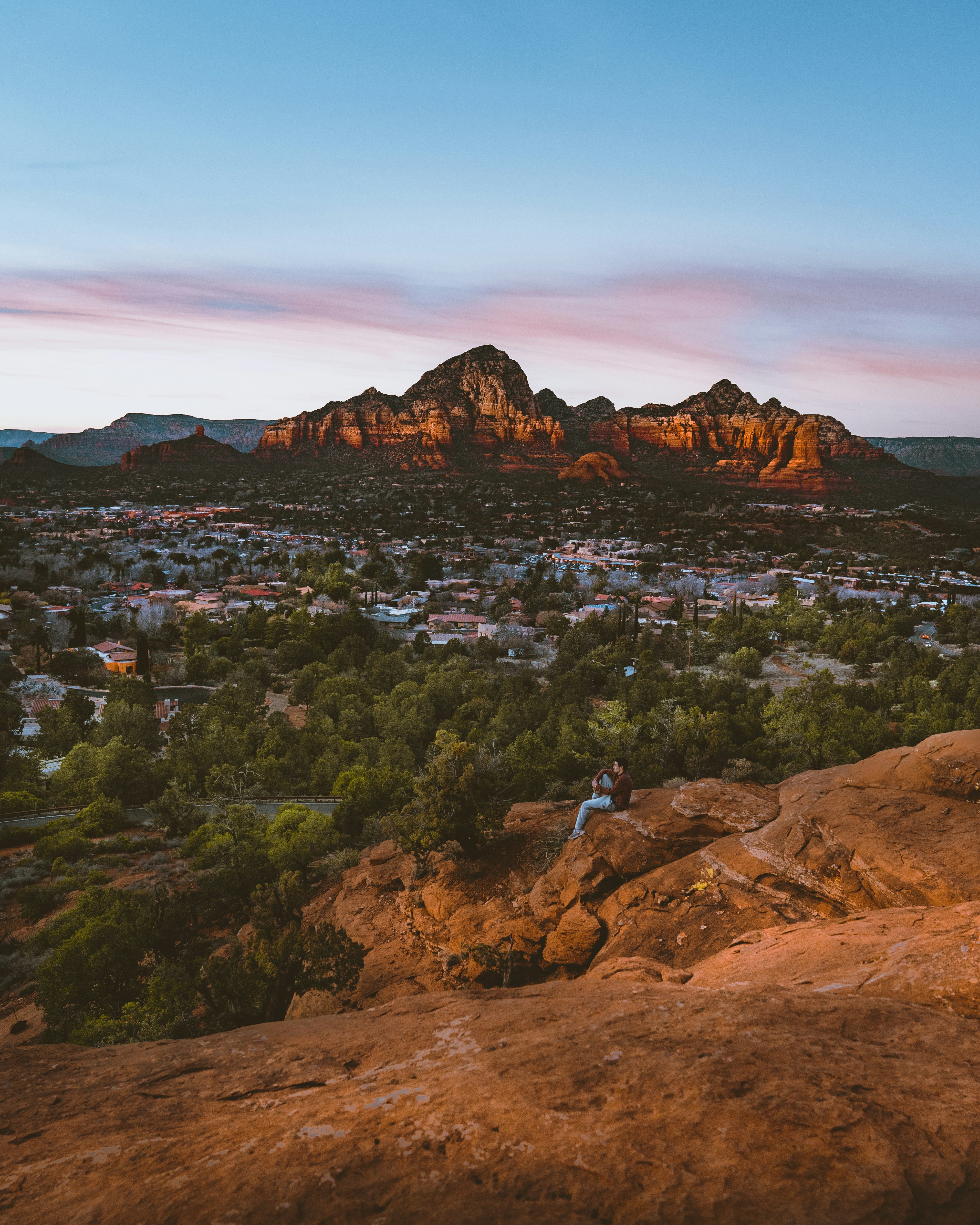 Crimson Ridge at Dusk: Mesas Crown a Quiet Desert Town