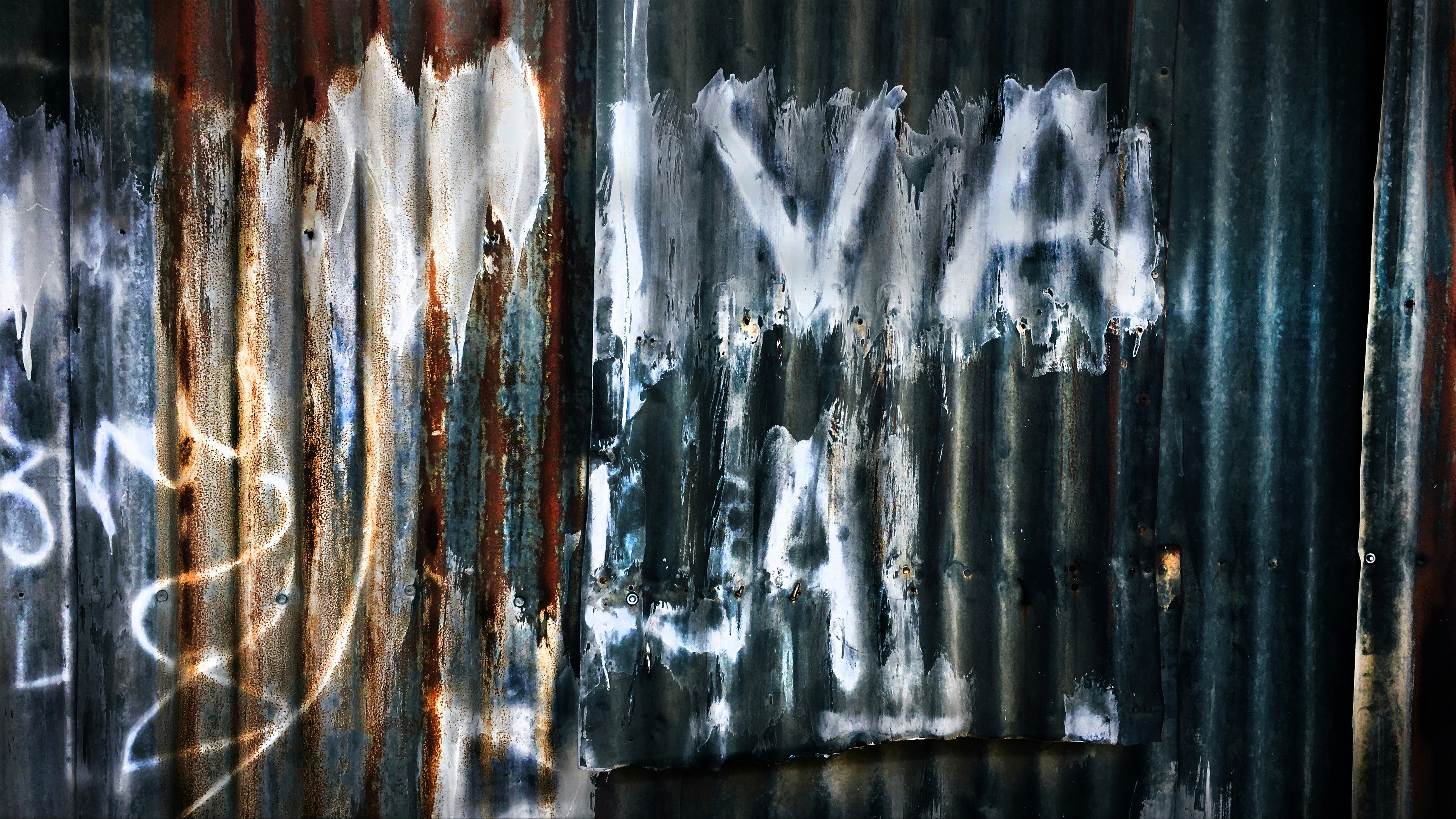 Graffiti Rivulets on Weathered Corrugation
