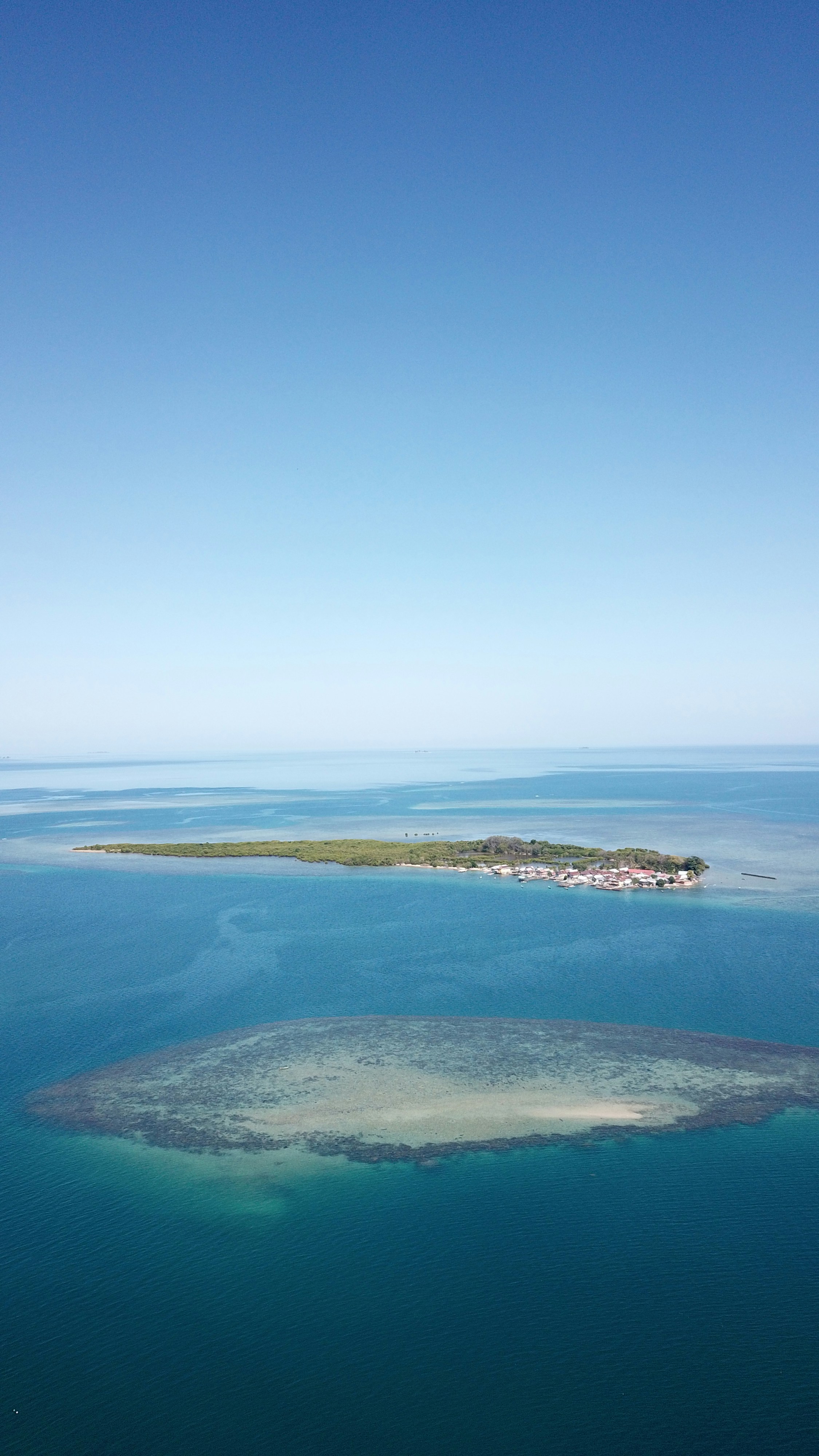 Lagoon Ringed Island: A Quiet Aerial Portrait