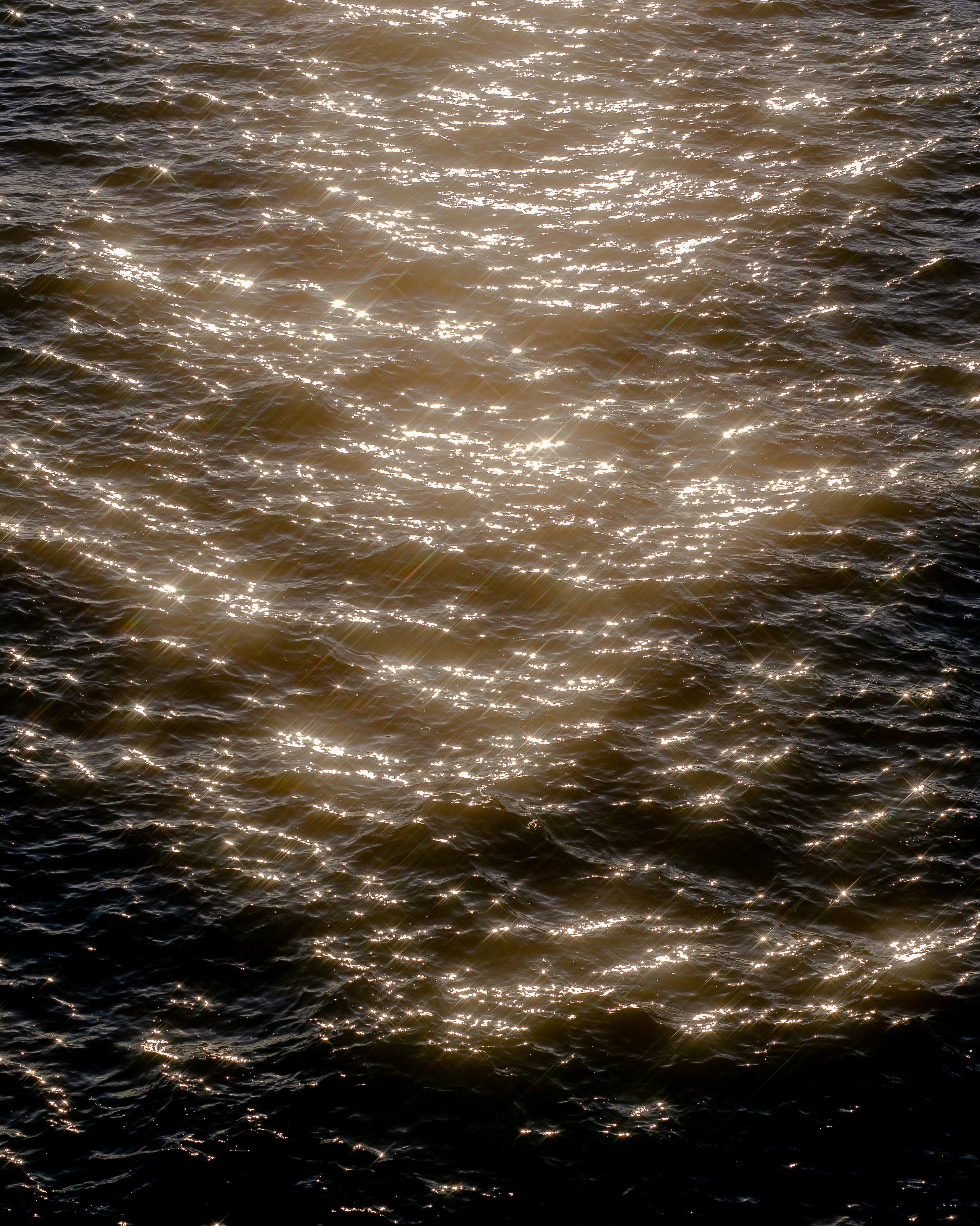 Golden Ribbon Across Choppy Water