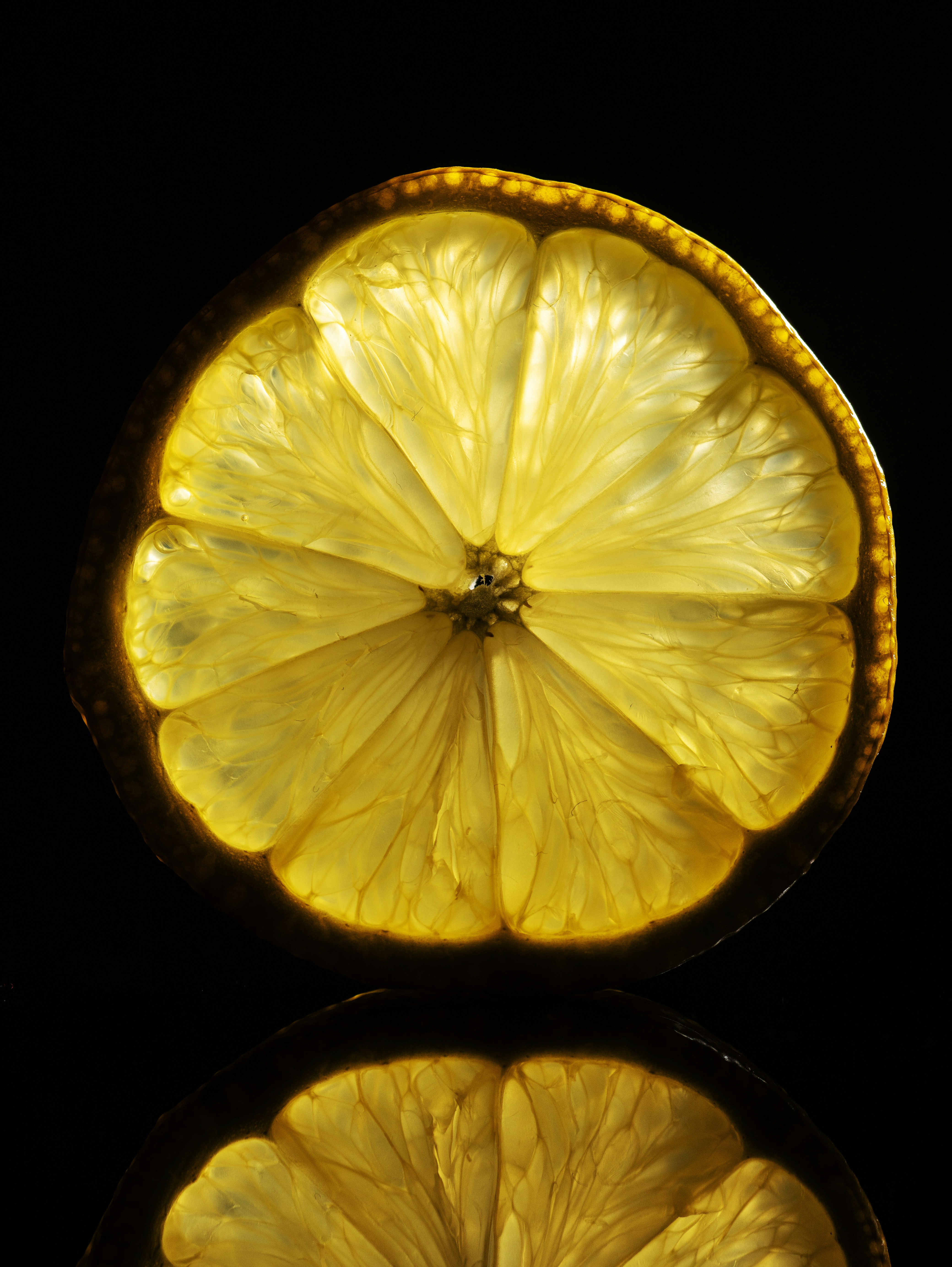 A slice of lemon sitting on top of a table photo – Free Food Image on ...