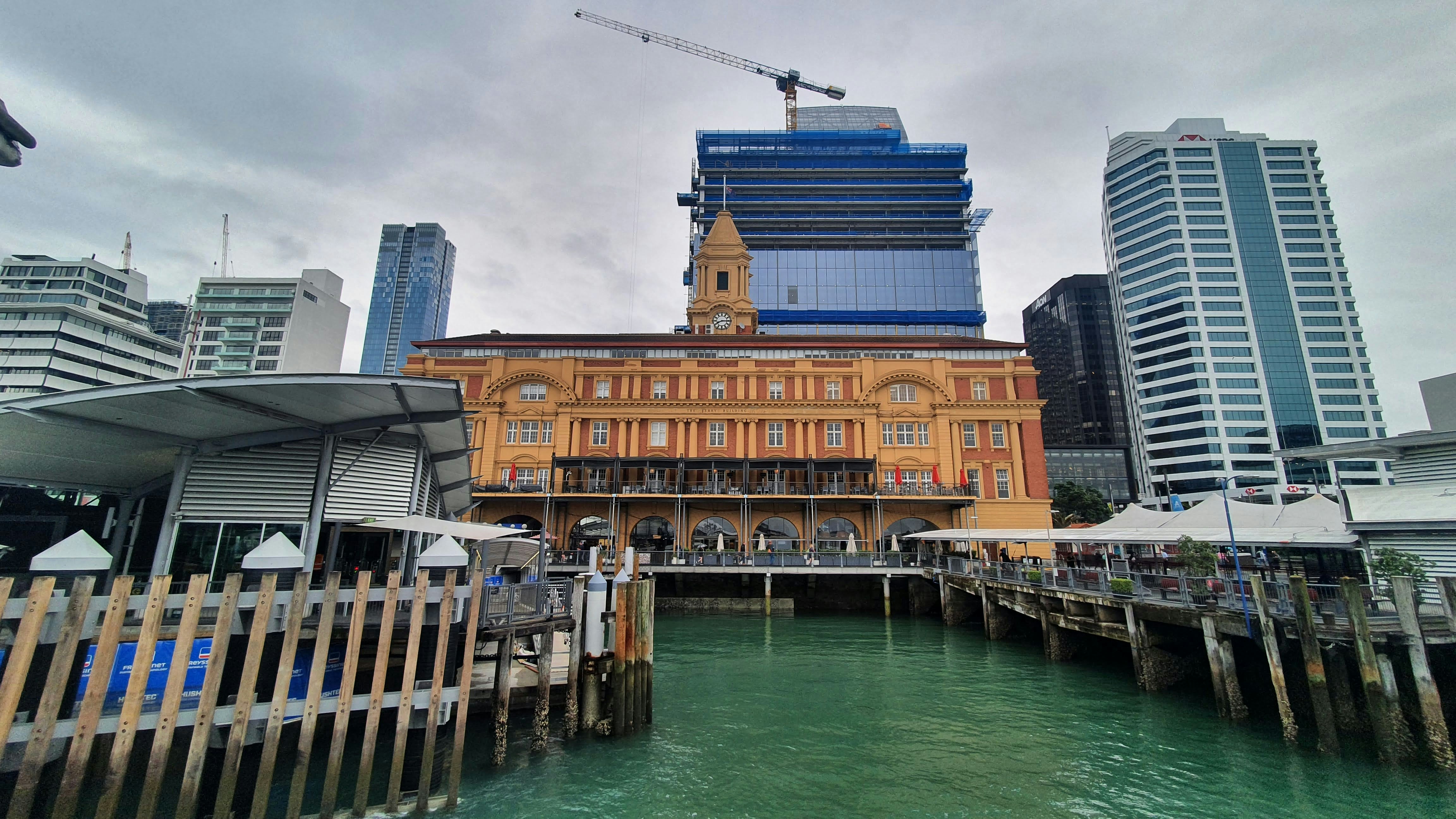 Brick Crown at the Waterfront: Historic Facade Between Glass Giants