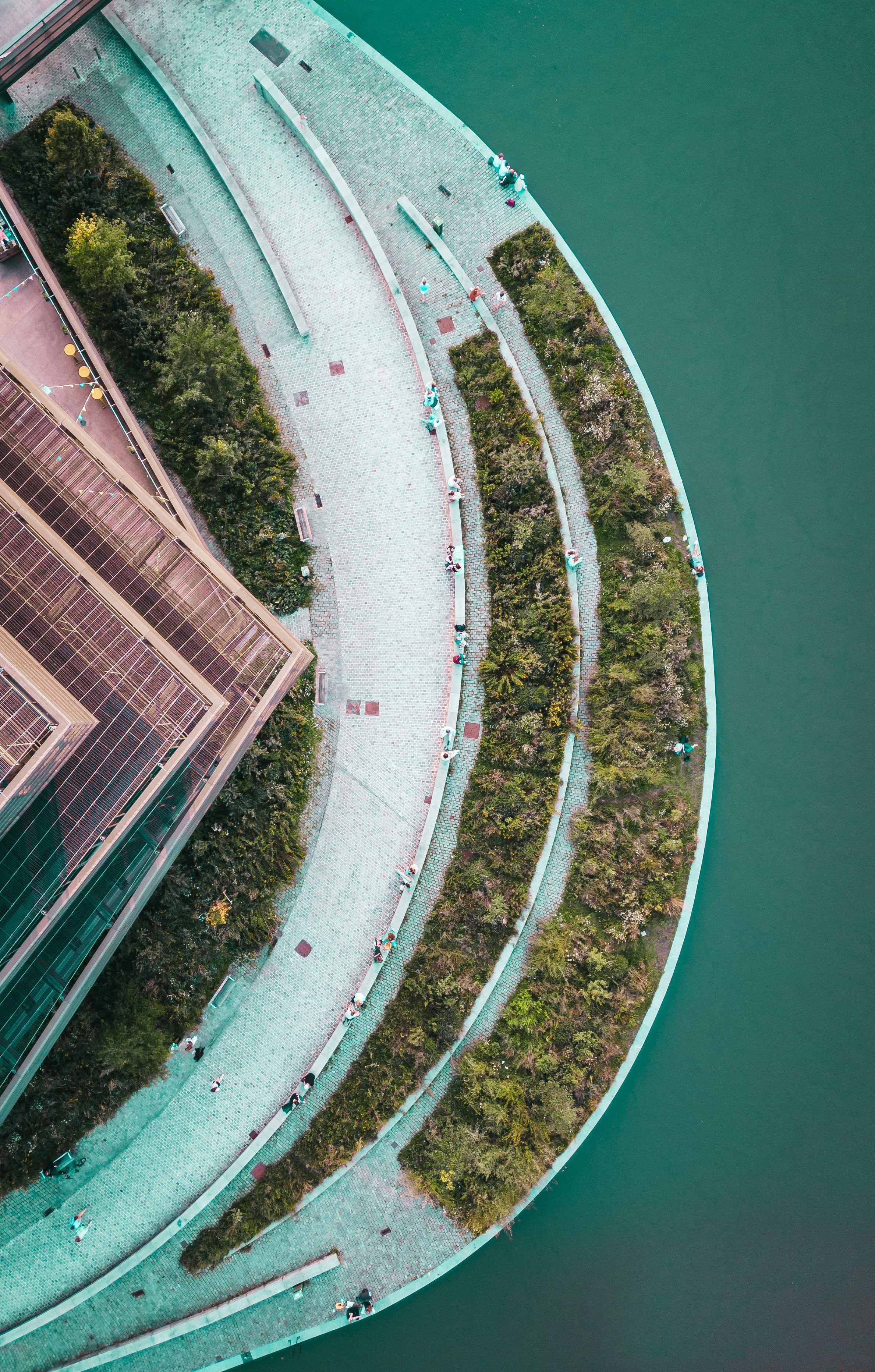 Ringed Riverside Promenade: An Aerial Portrait of a Circular Waterfront Path