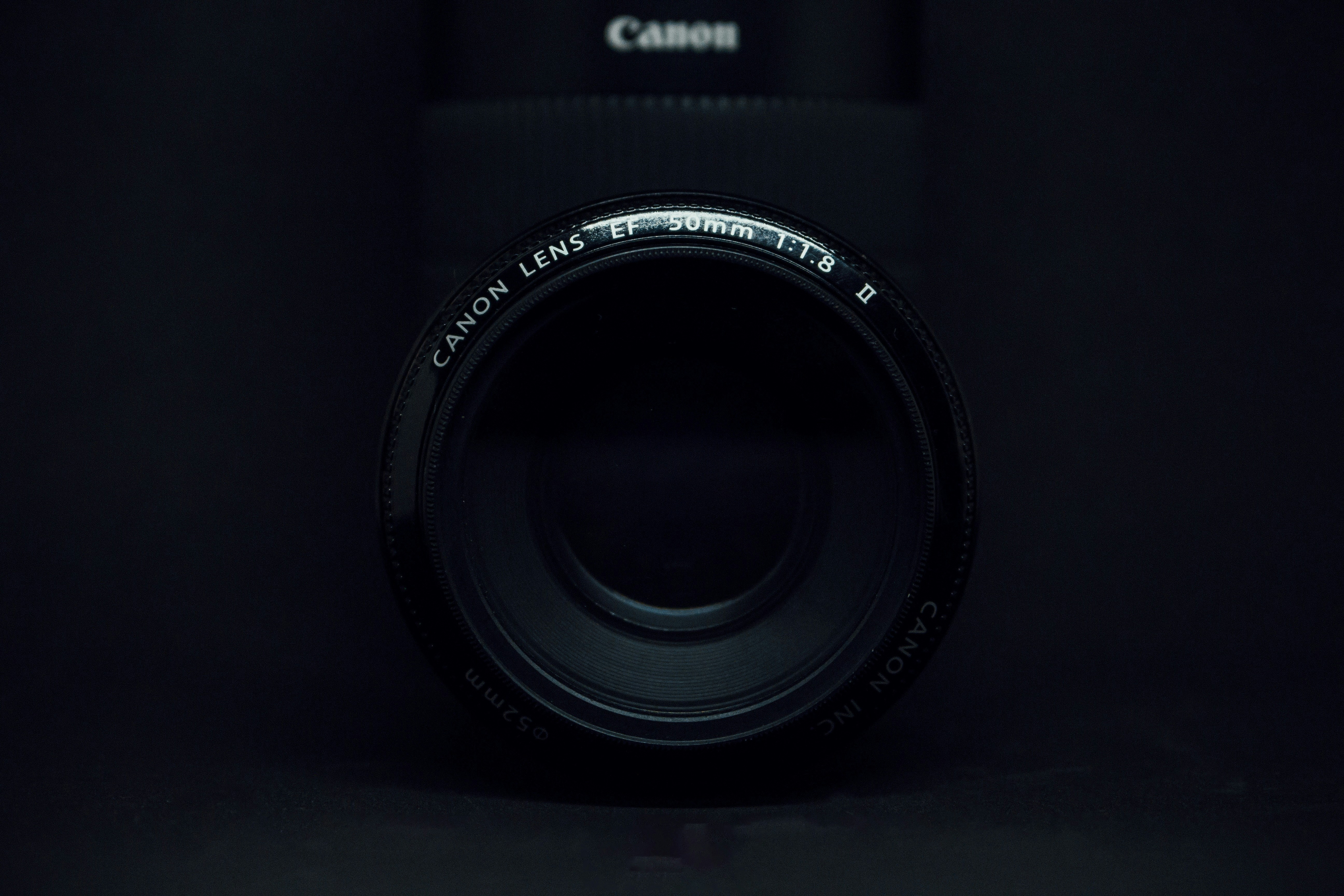 A camera lens sitting on top of a table photo – Free Camera Image on ...