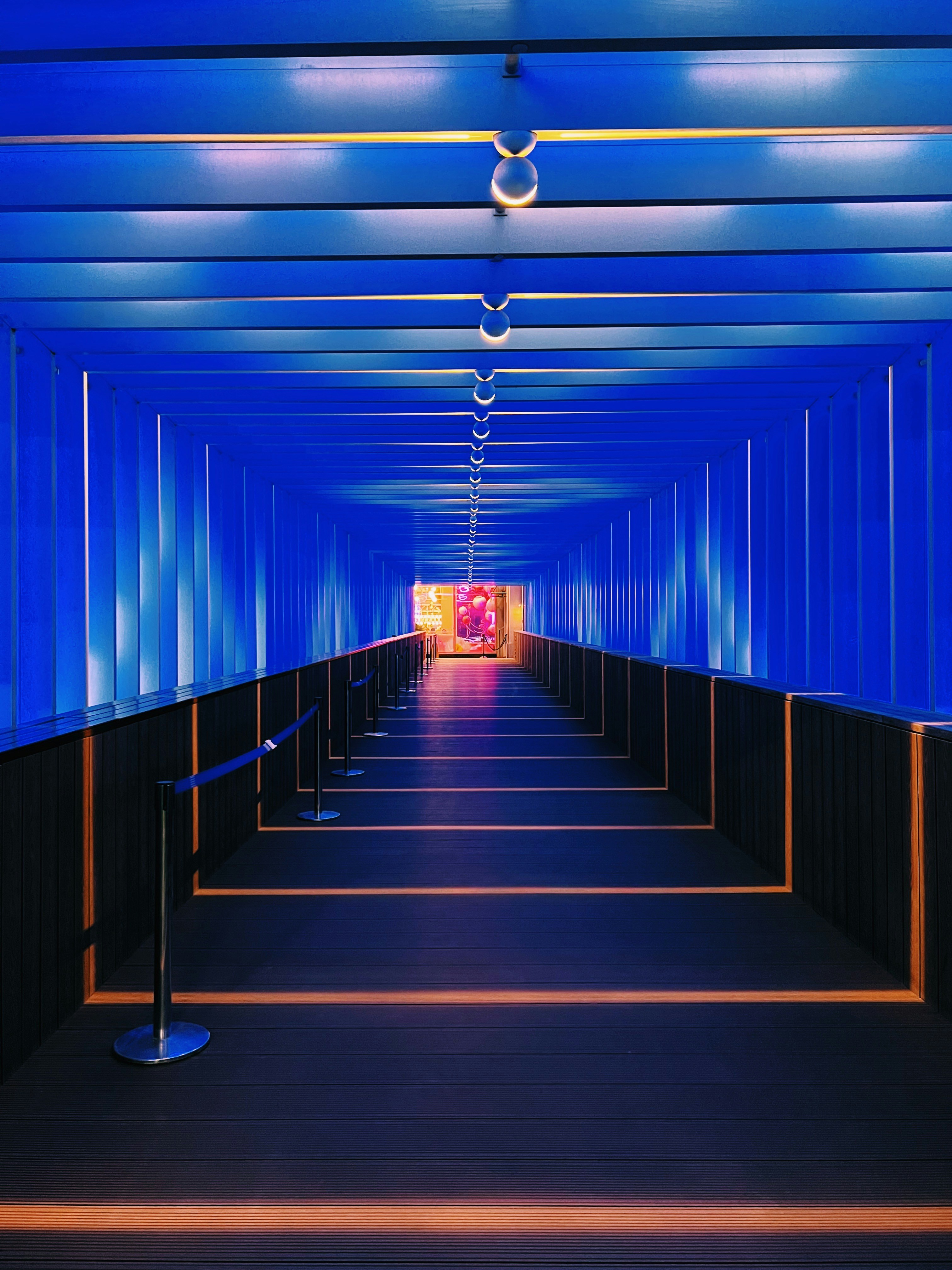 Blue Neon Corridor: A Symmetrical Walk Toward a Glowing Exit