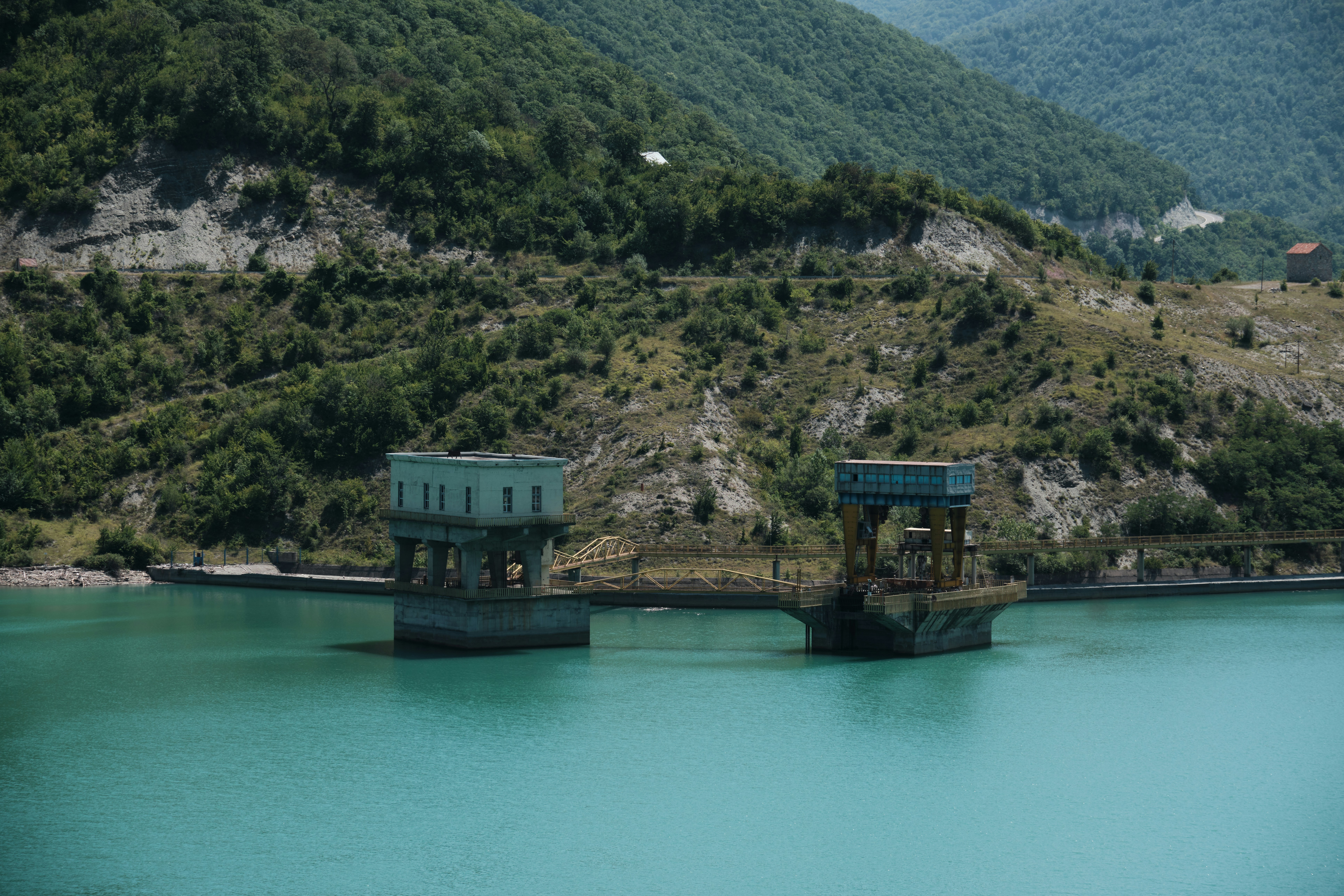 Twin Turquoise Towers Loom Over a Tranquil Reservoir