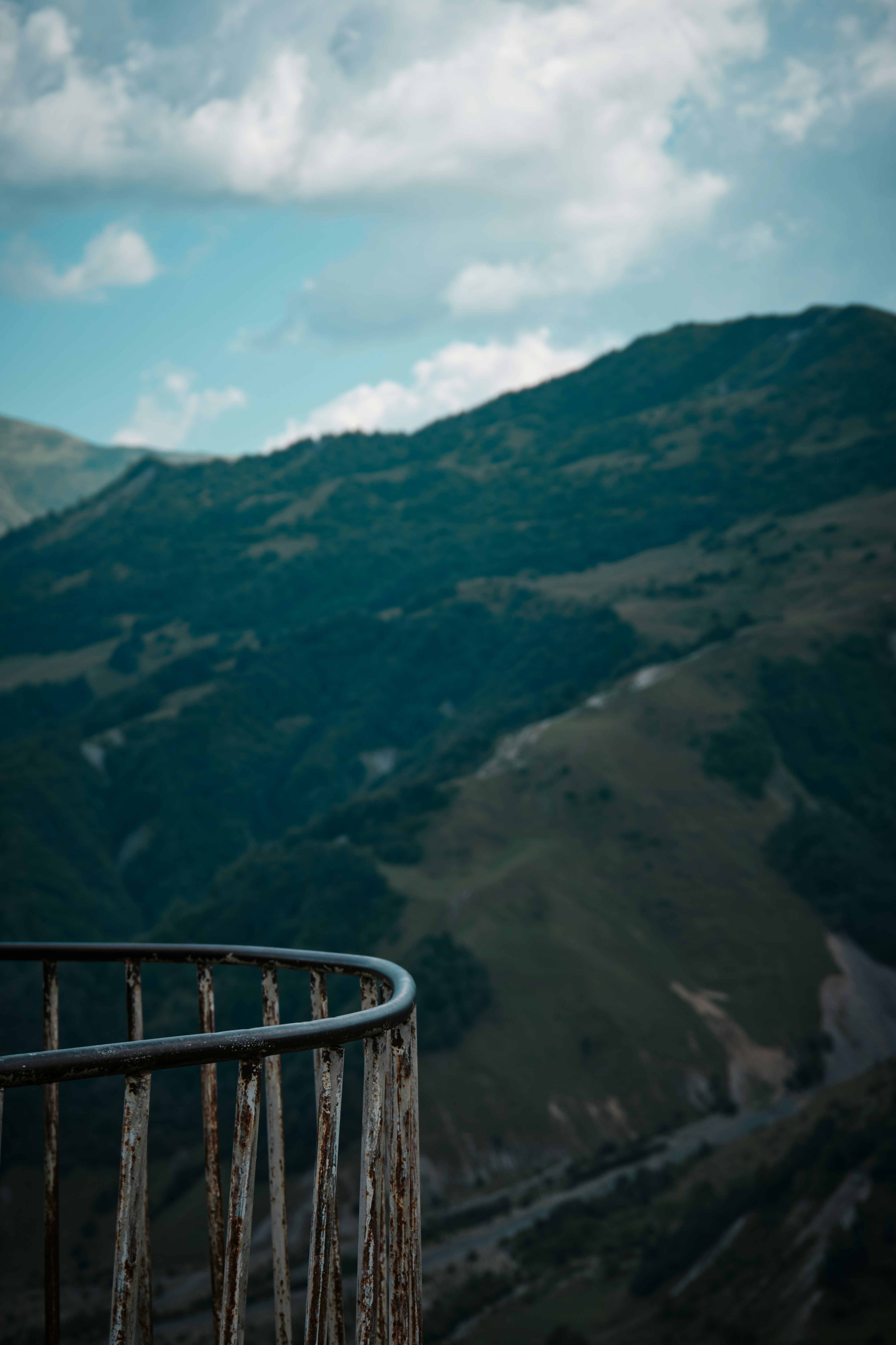 Rusted Edge: Rail Framing a Quiet Gorge