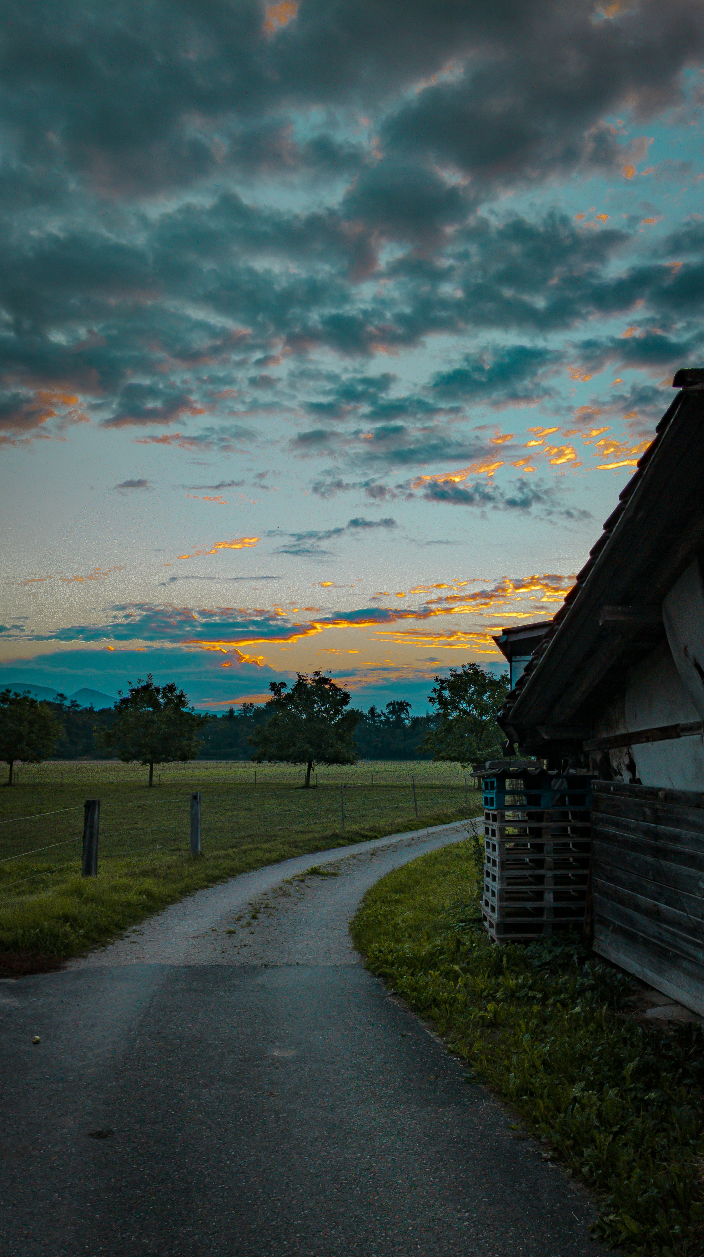 A road that has a house on the side of it photo – Free Road Image on ...