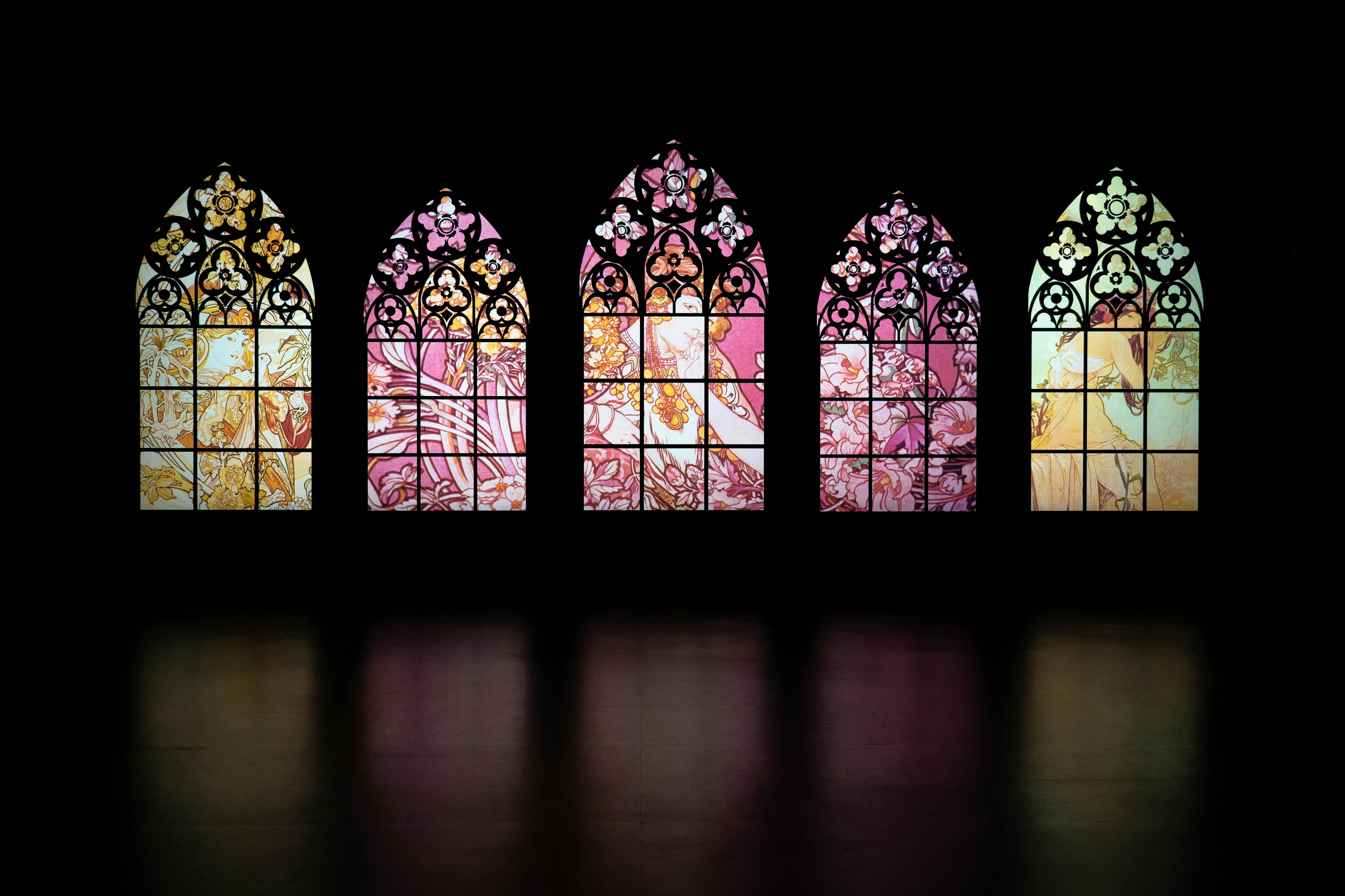 A set of four stained glass windows in a dark room photo – Free Light ...
