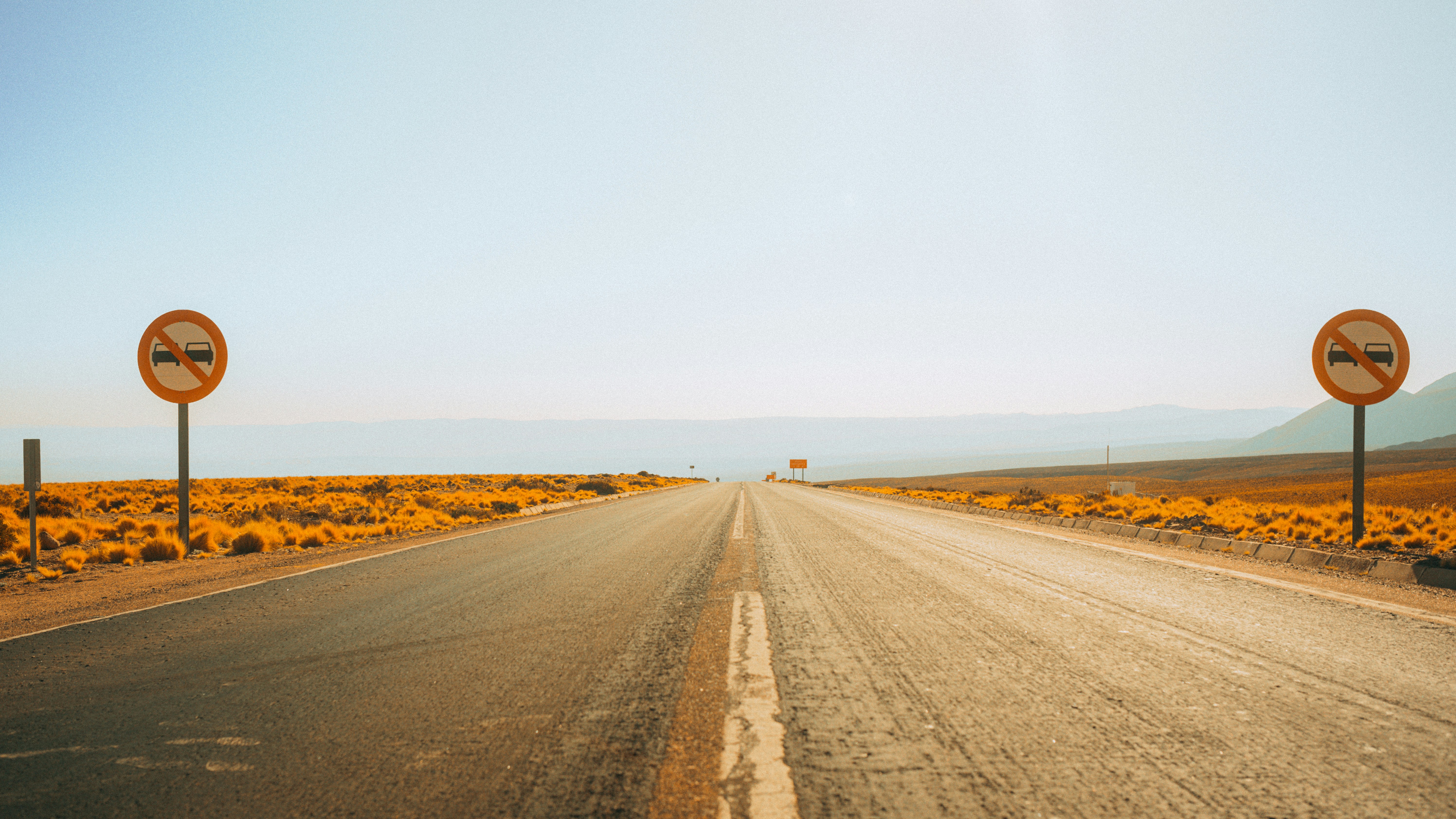 Two road signs on the side of the road photo – Free Atacama Image on ...