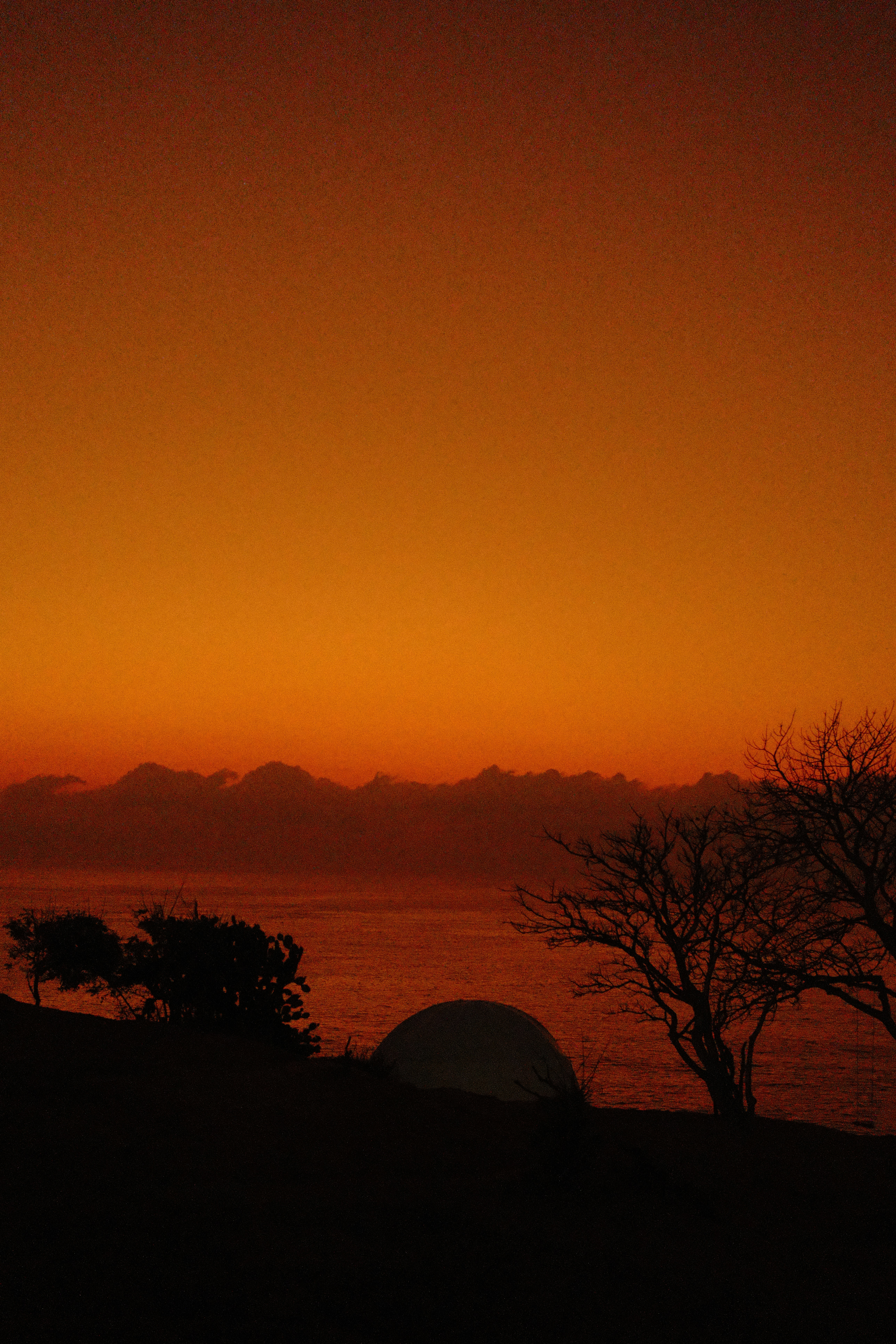 Horizon Ember: silhouettes beneath a molten sunset