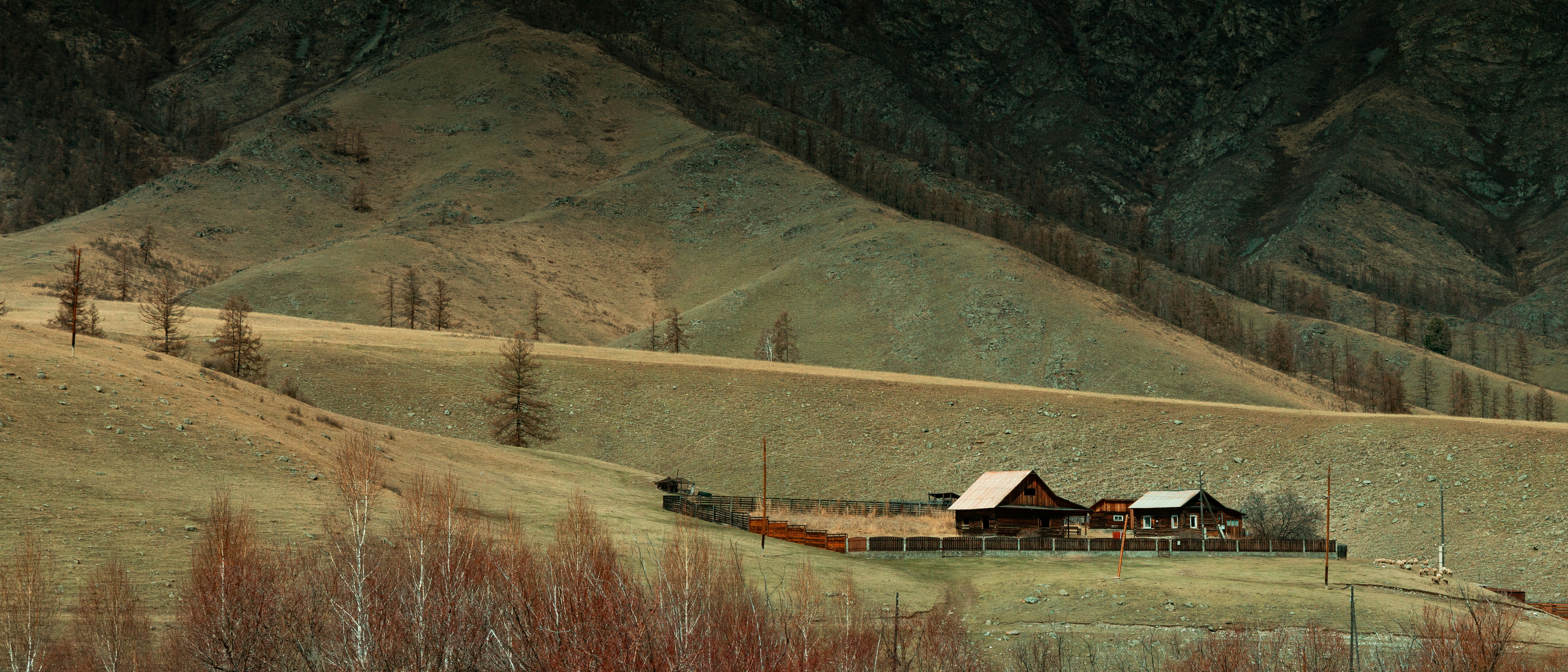 Hushed Valley Farmstead under Rolling Hills