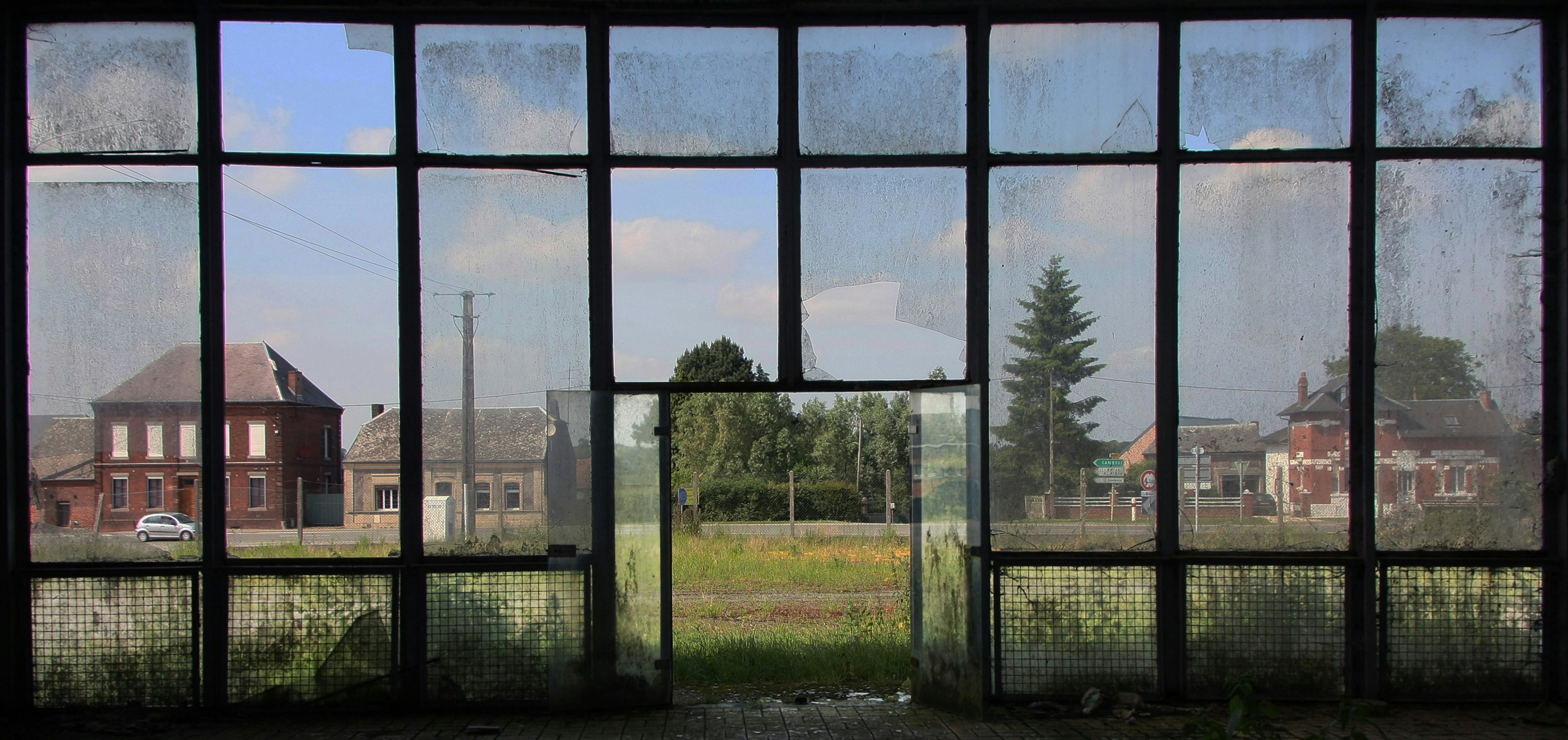A view of a building through a window photo – Free Urbex Image on Unsplash