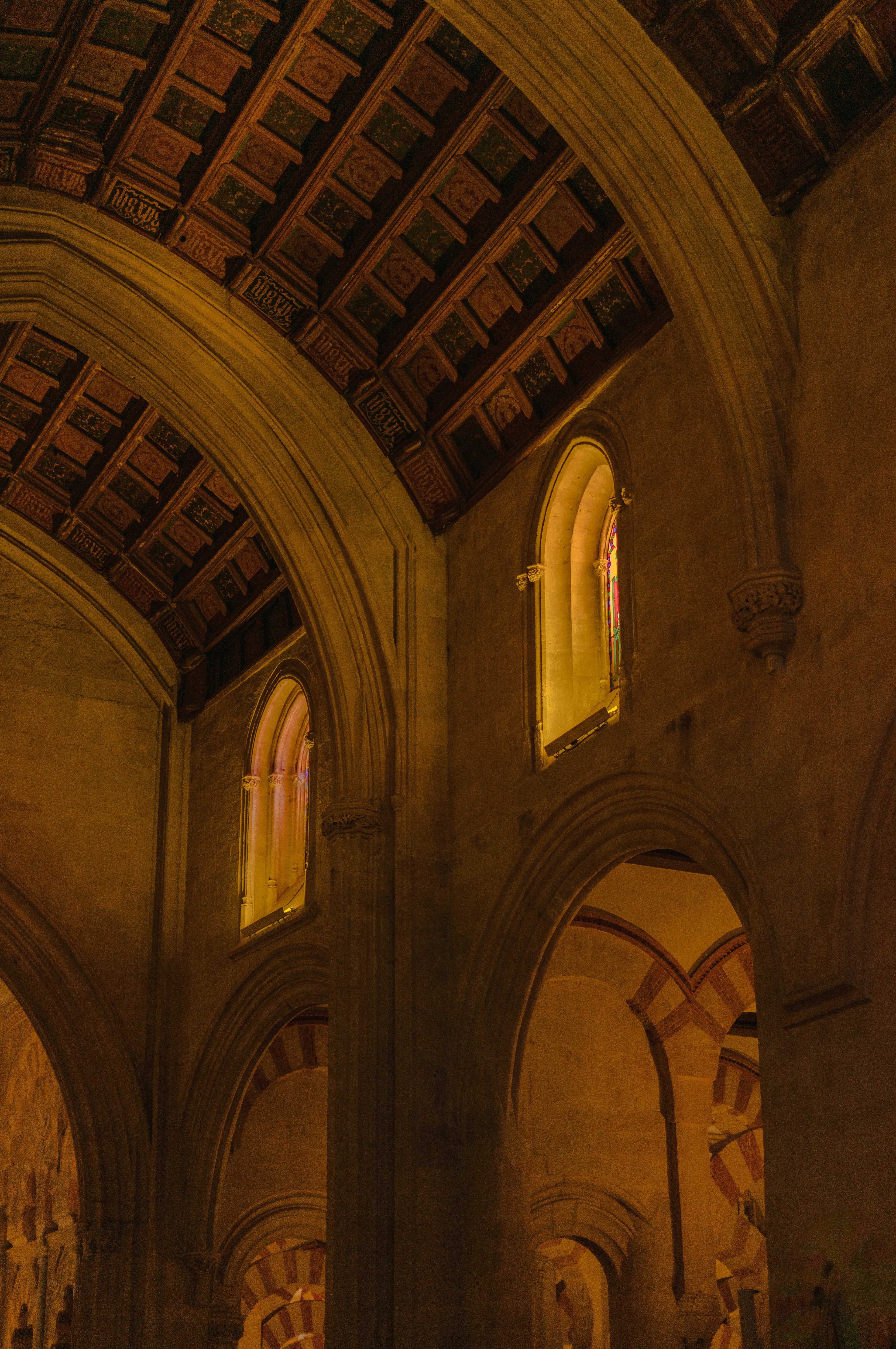 A large cathedral with vaulted ceilings and stained glass windows photo ...