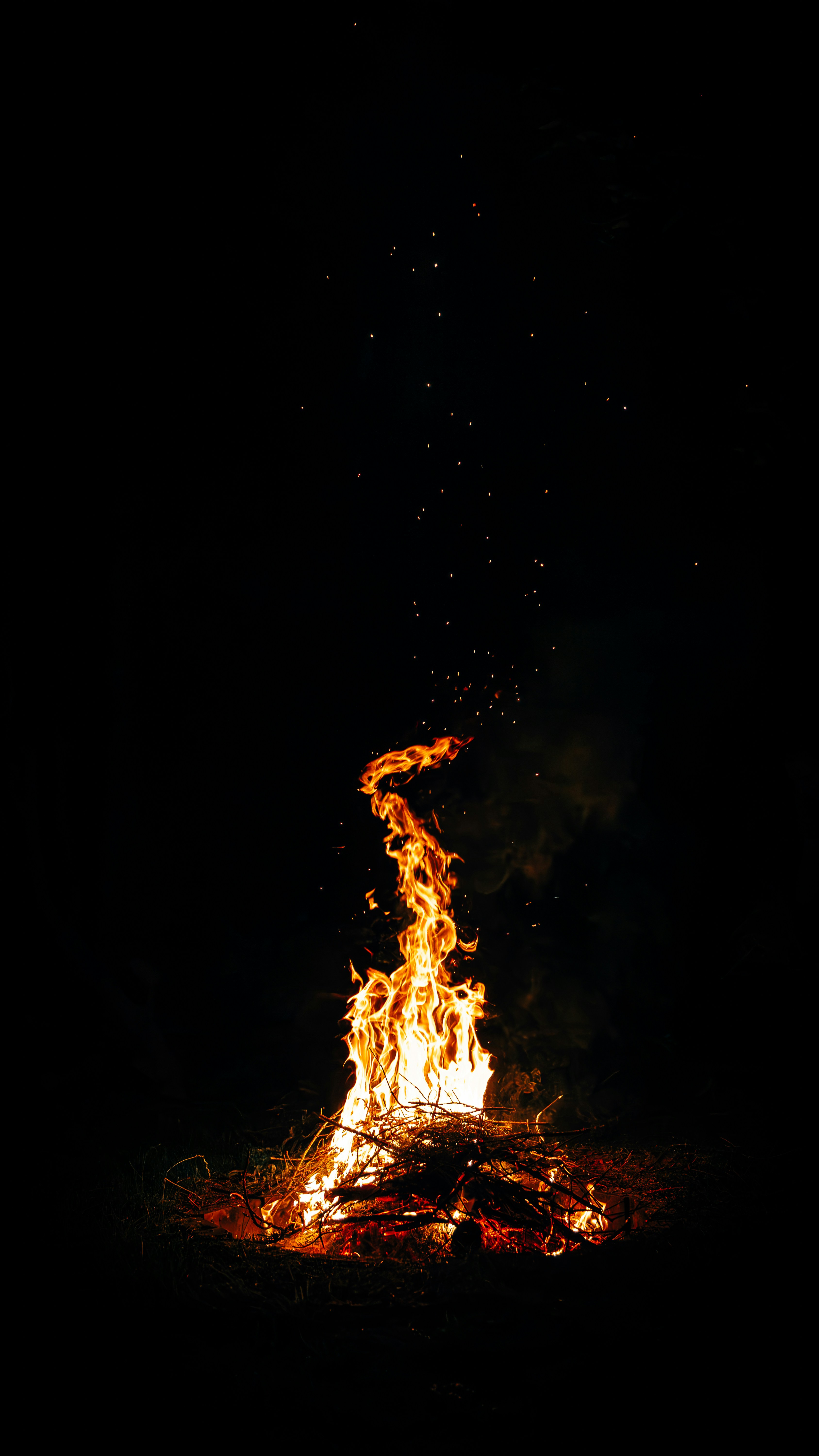 A fire is lit up in the dark photo – Free Fire Image on Unsplash