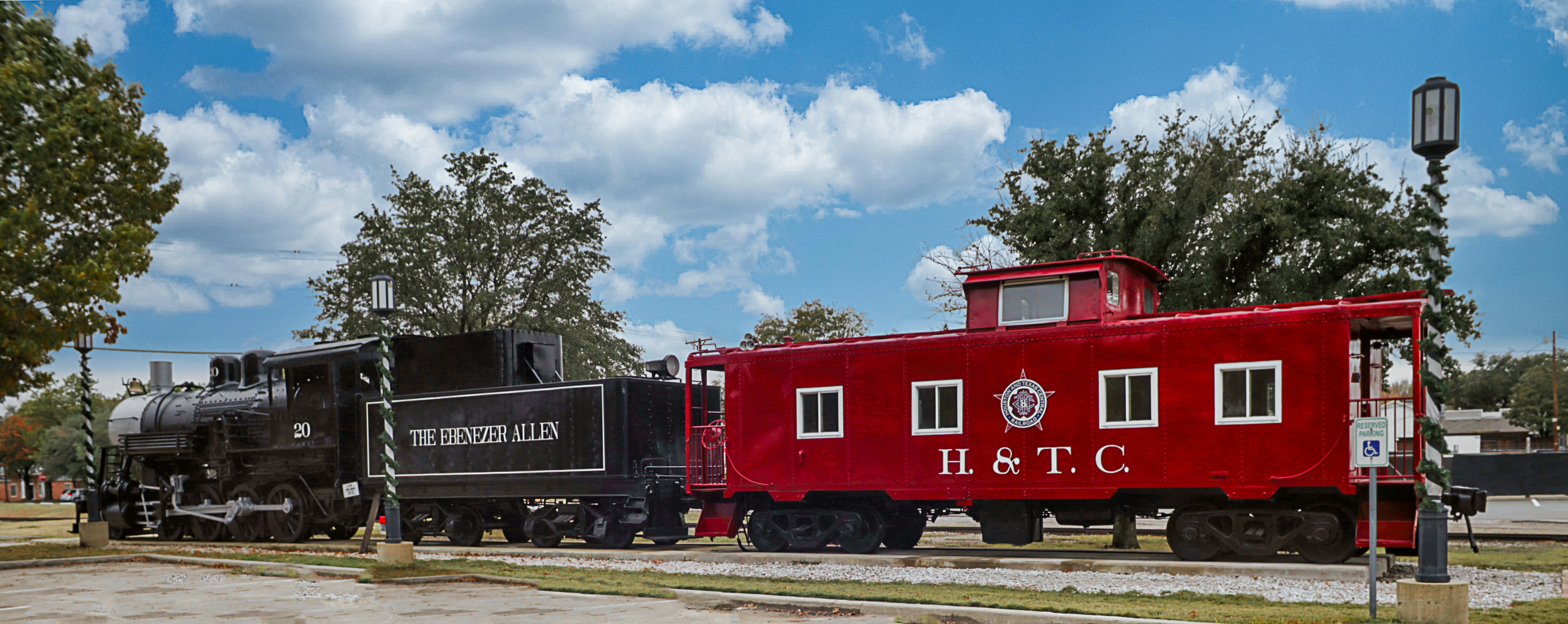 Crimson Caboose in a Quiet Railyard: Heritage Iron on a Sunny Day