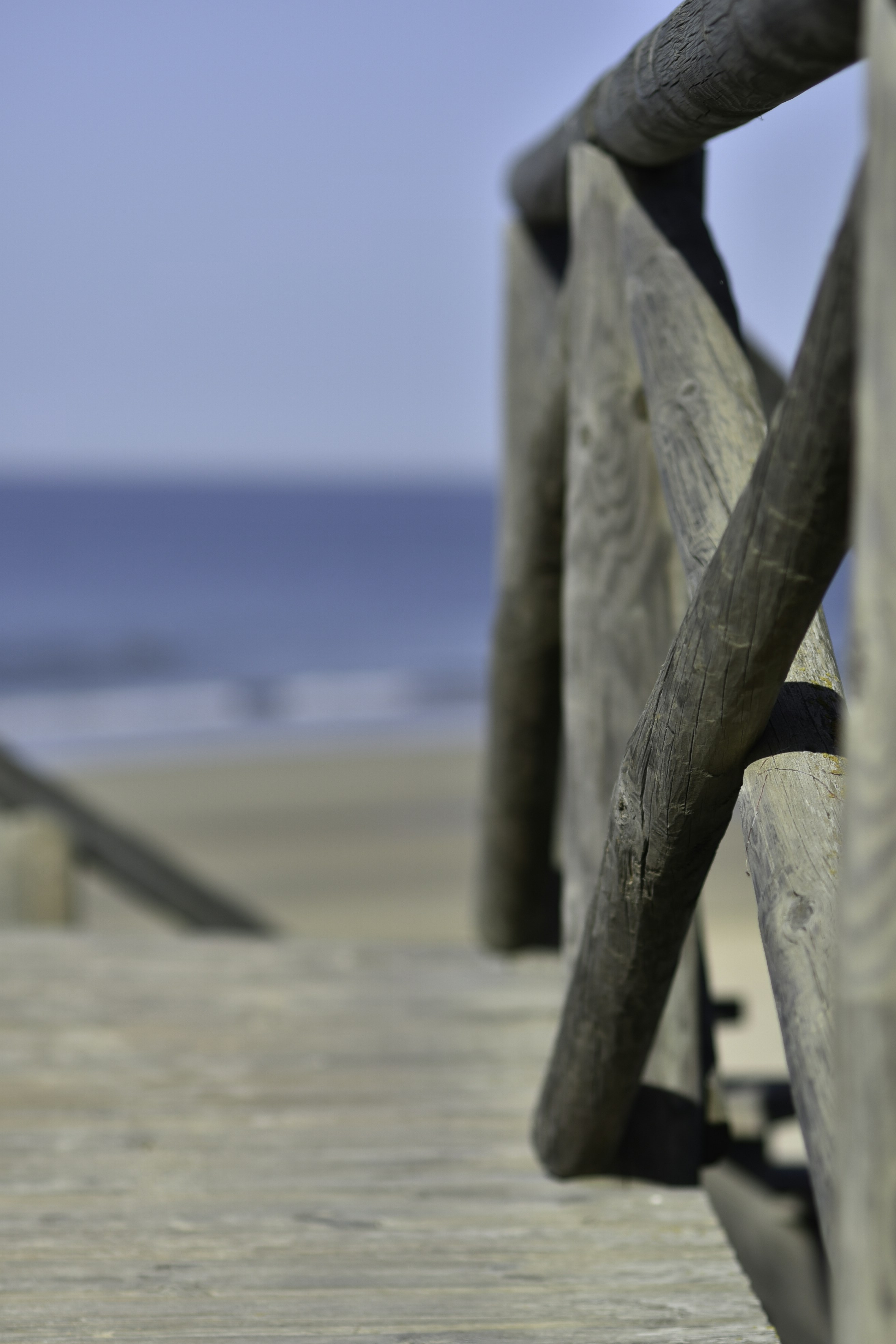 Sun-worn Seaside Railings: A Path to the Horizon
