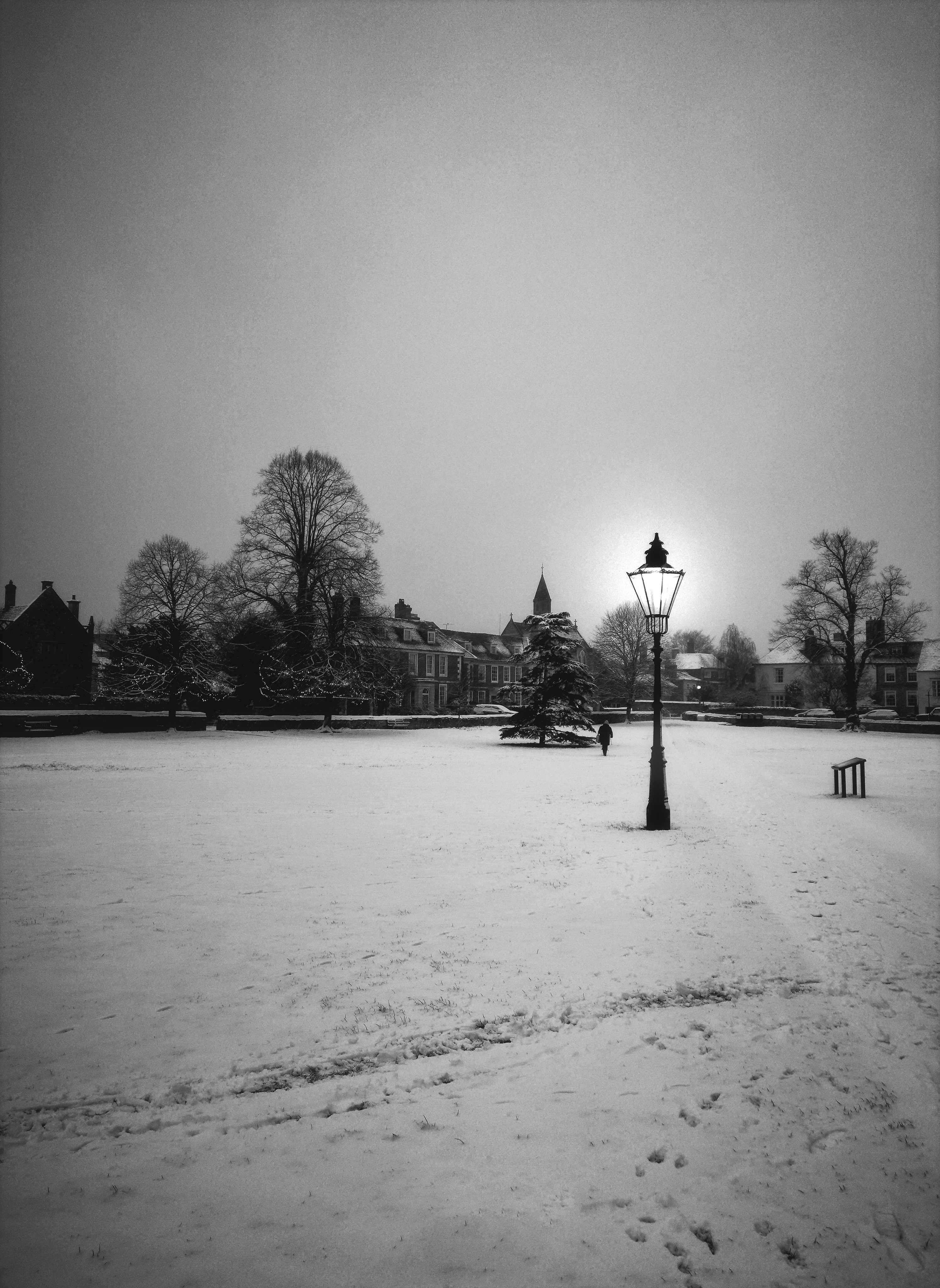 Winter Lantern Over a Frosted Town Park
