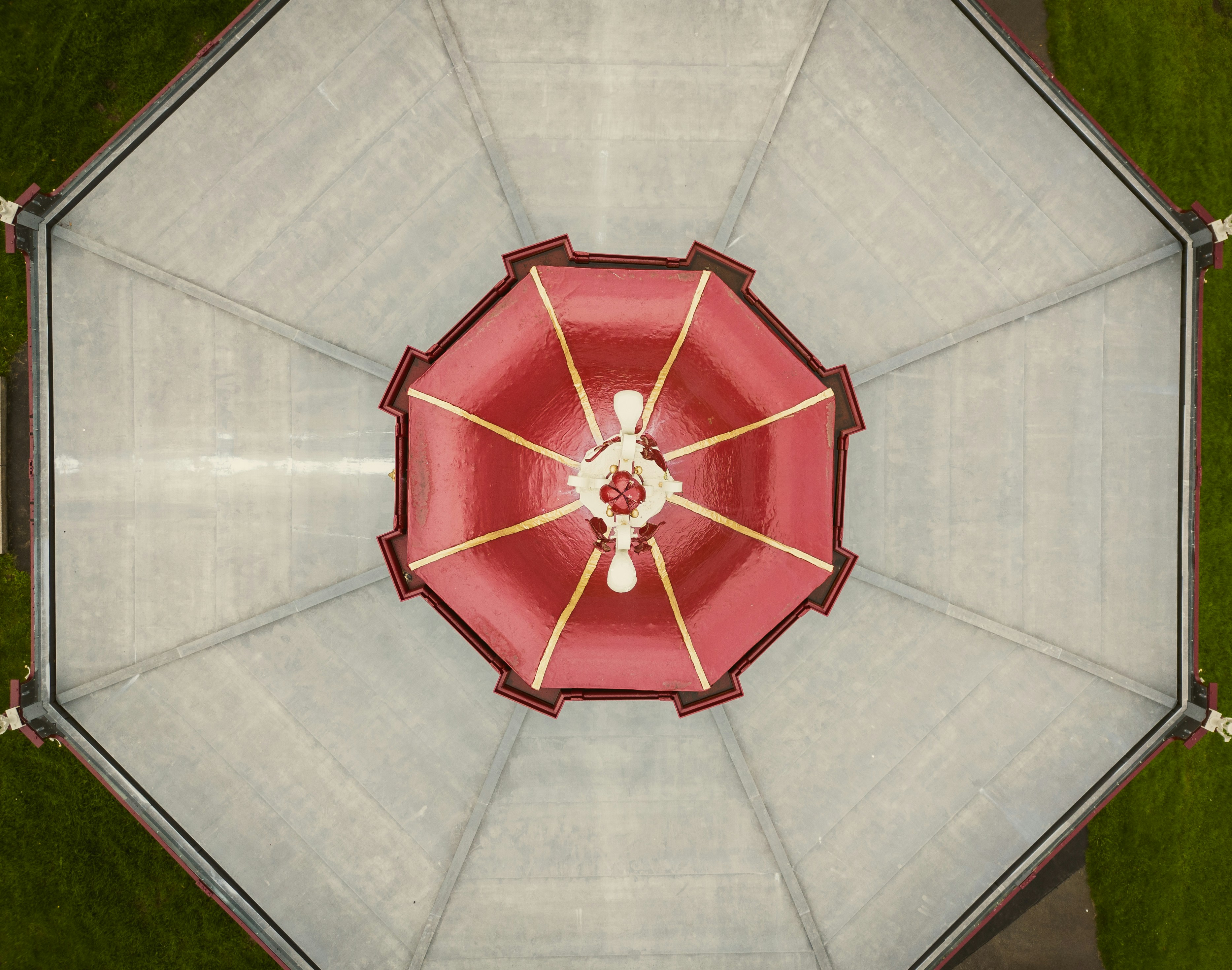 Red-Crowned Octagonal Pavilion: Aerial Symmetry at the Park's Center