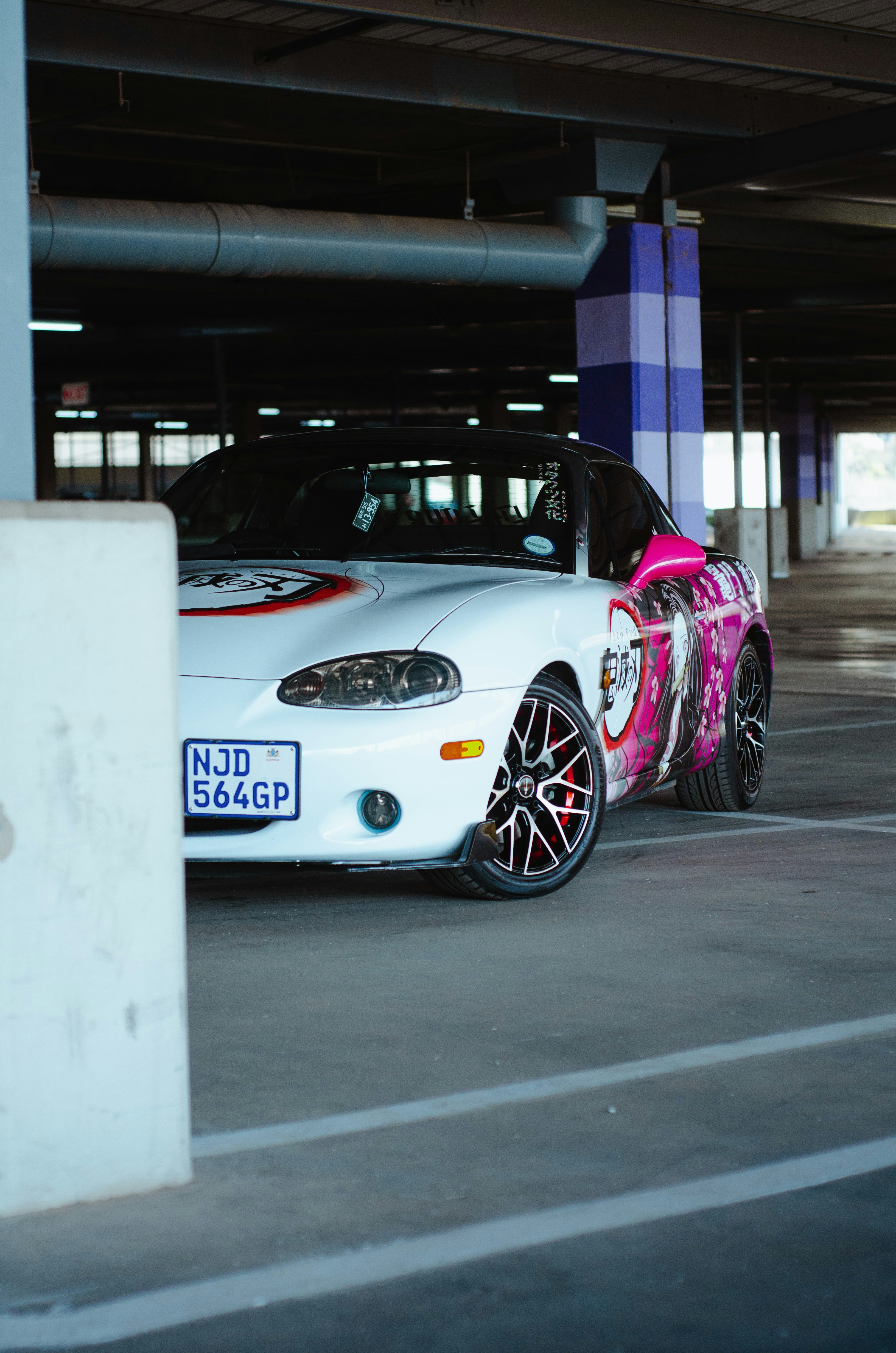 Neon-Wrapped Miata in a Concrete Lair