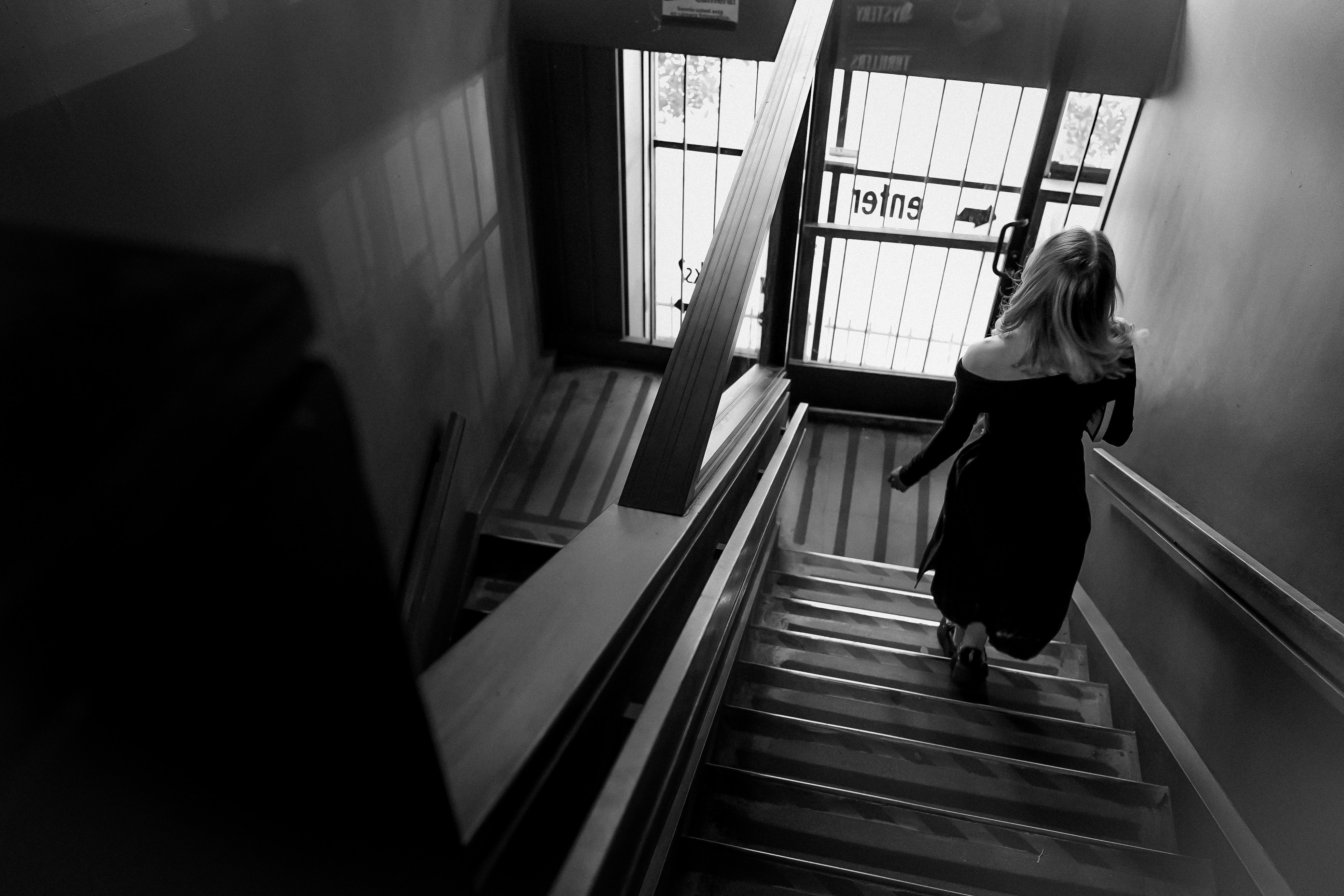 A woman walking down a flight of stairs photo – Free Los angeles Image ...