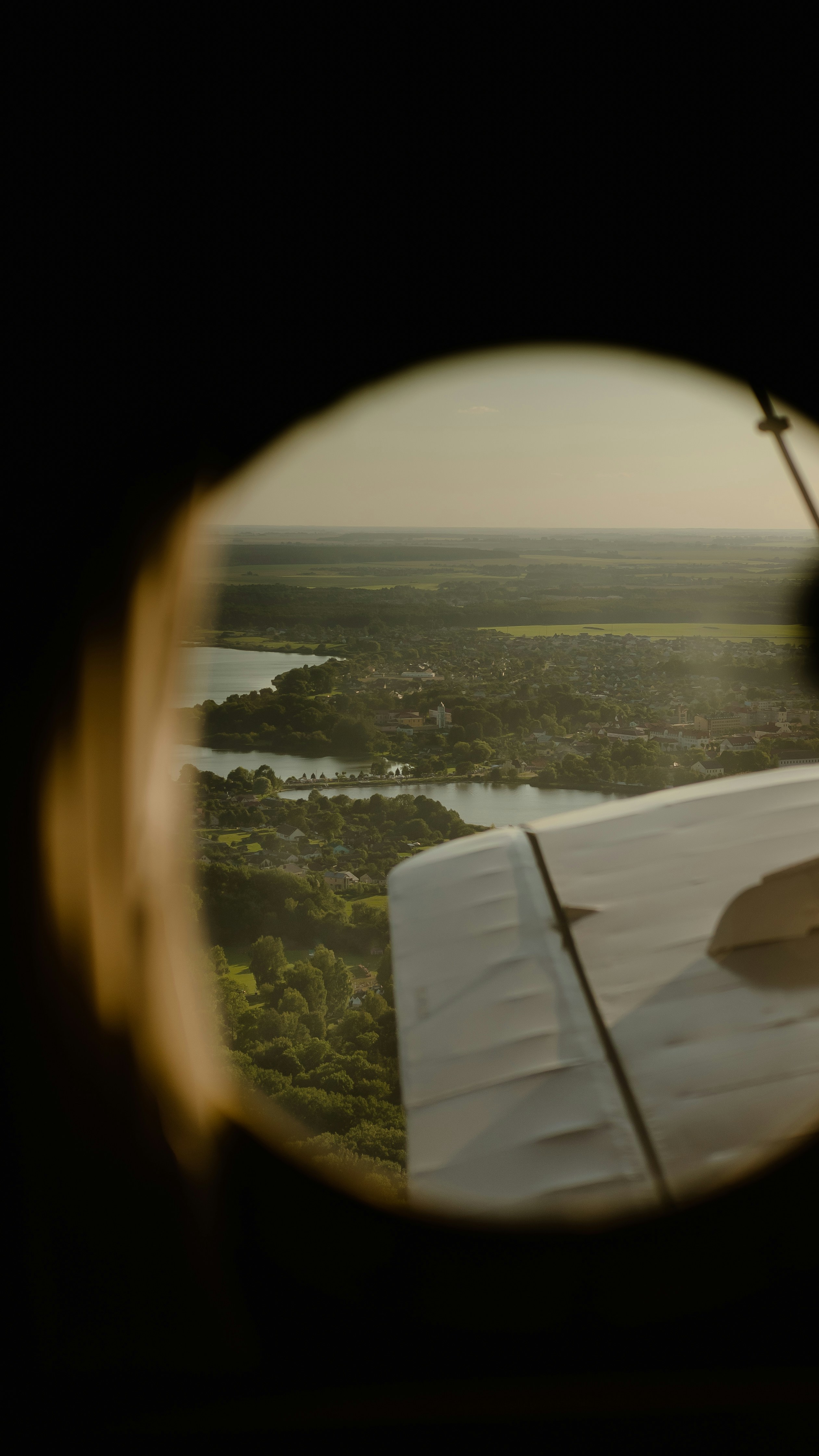 Circular Window, Quiet River: Aerial Patchwork from a Plane