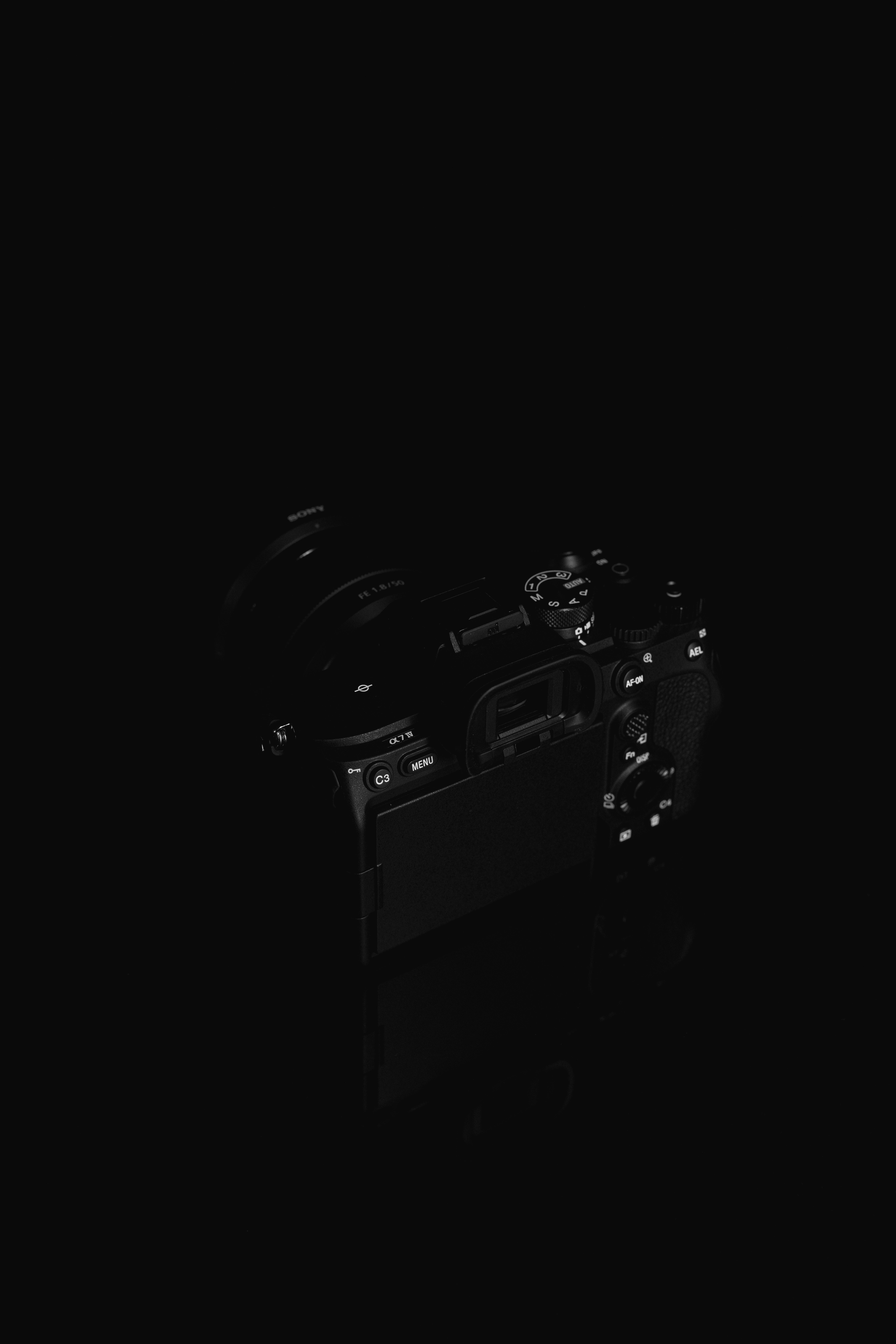 A black and white photo of a camera in the dark photo – Free Sony Image ...