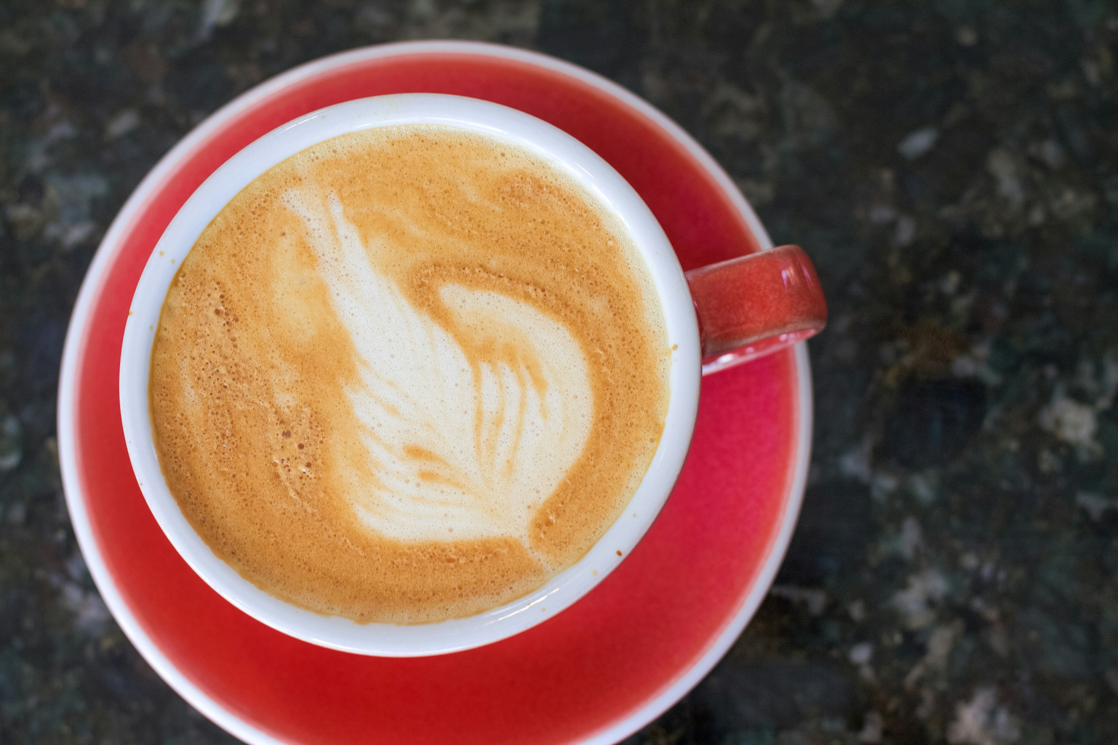 Coffee cup against a granite background.