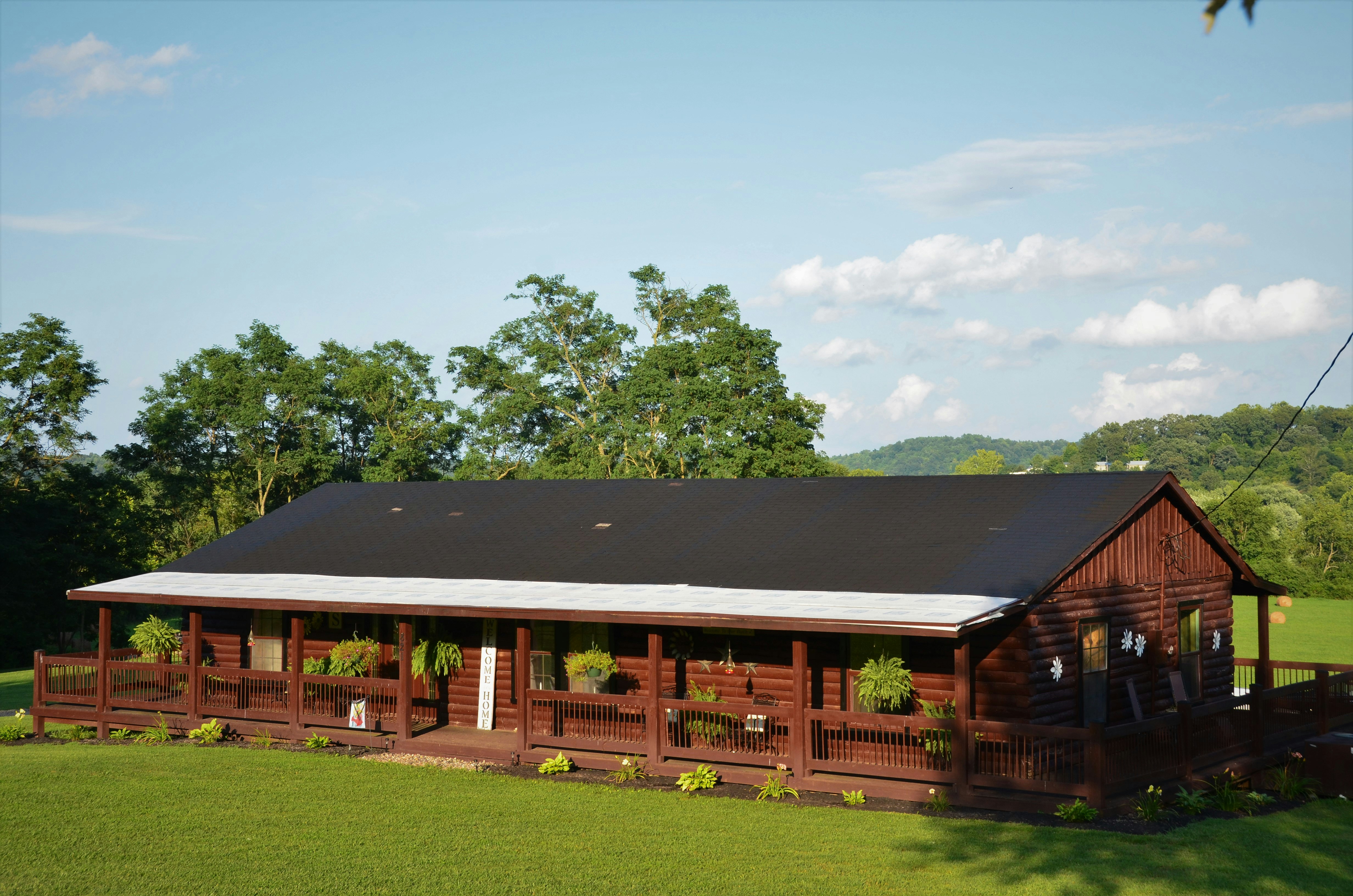 Sunlit Barn Roof and Veranda in a Quiet Rural Glade