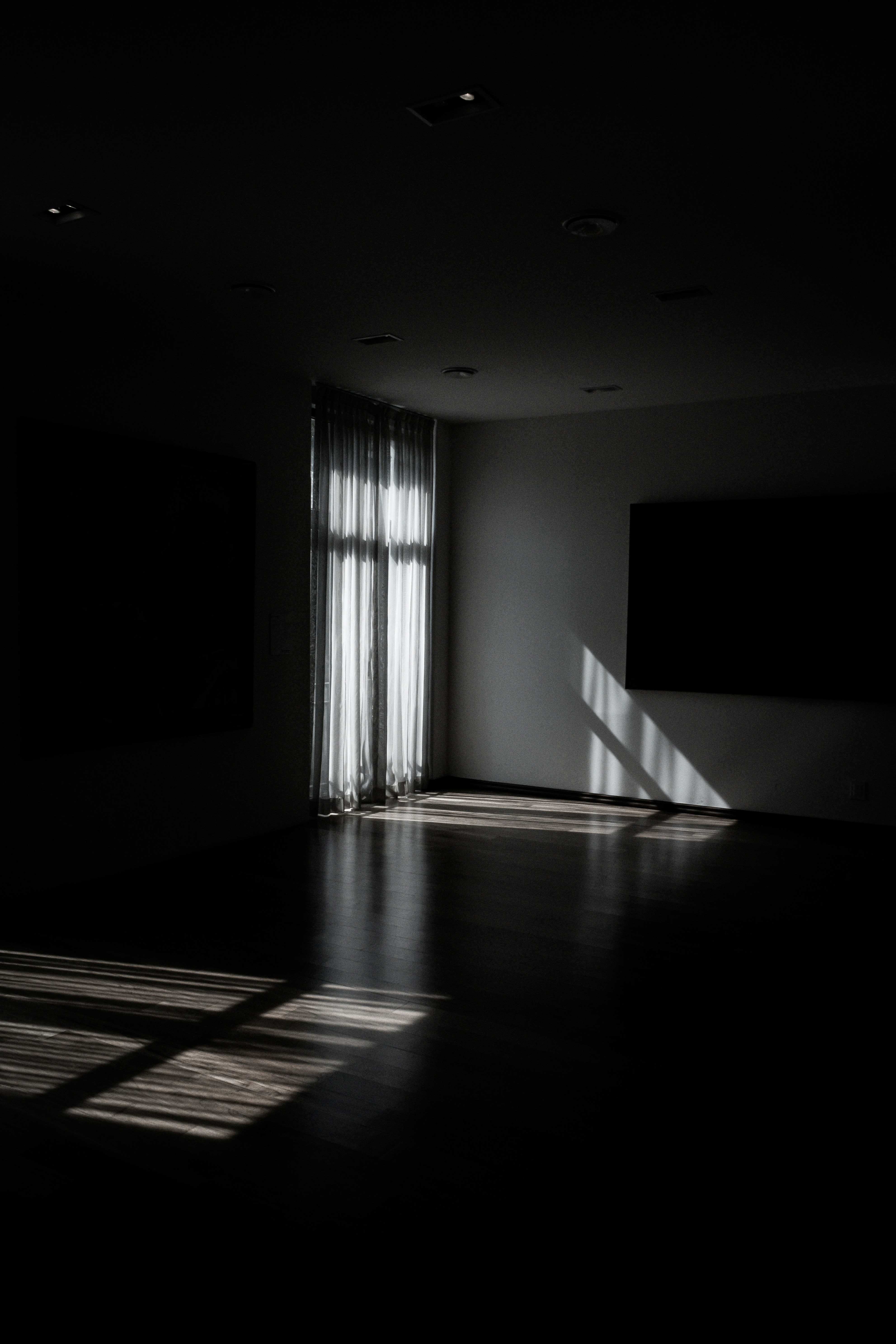 A dark room with light coming through the windows photo – Free Building ...