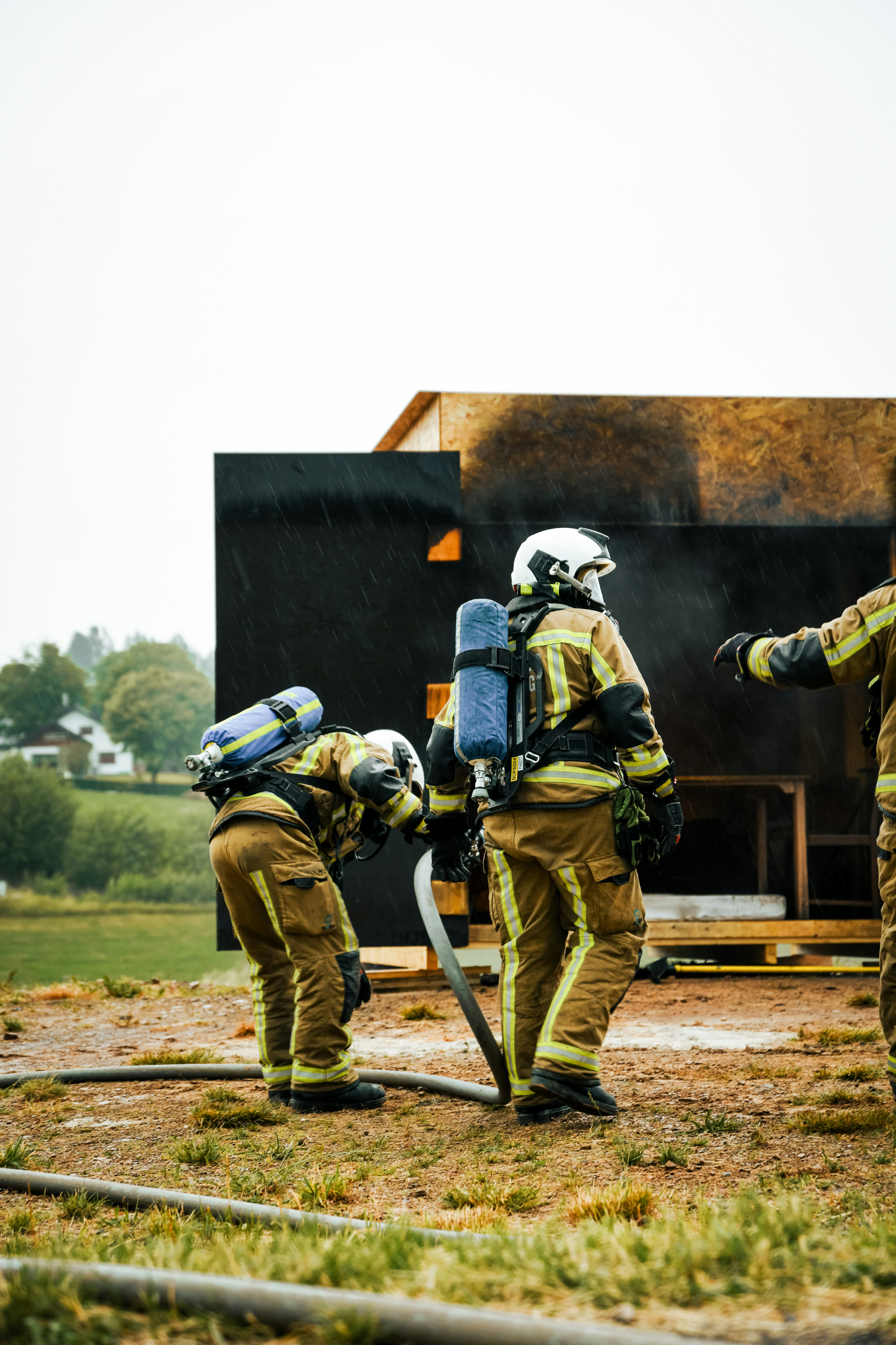 A group of firemen standing next to each other photo – Free Fire Image ...